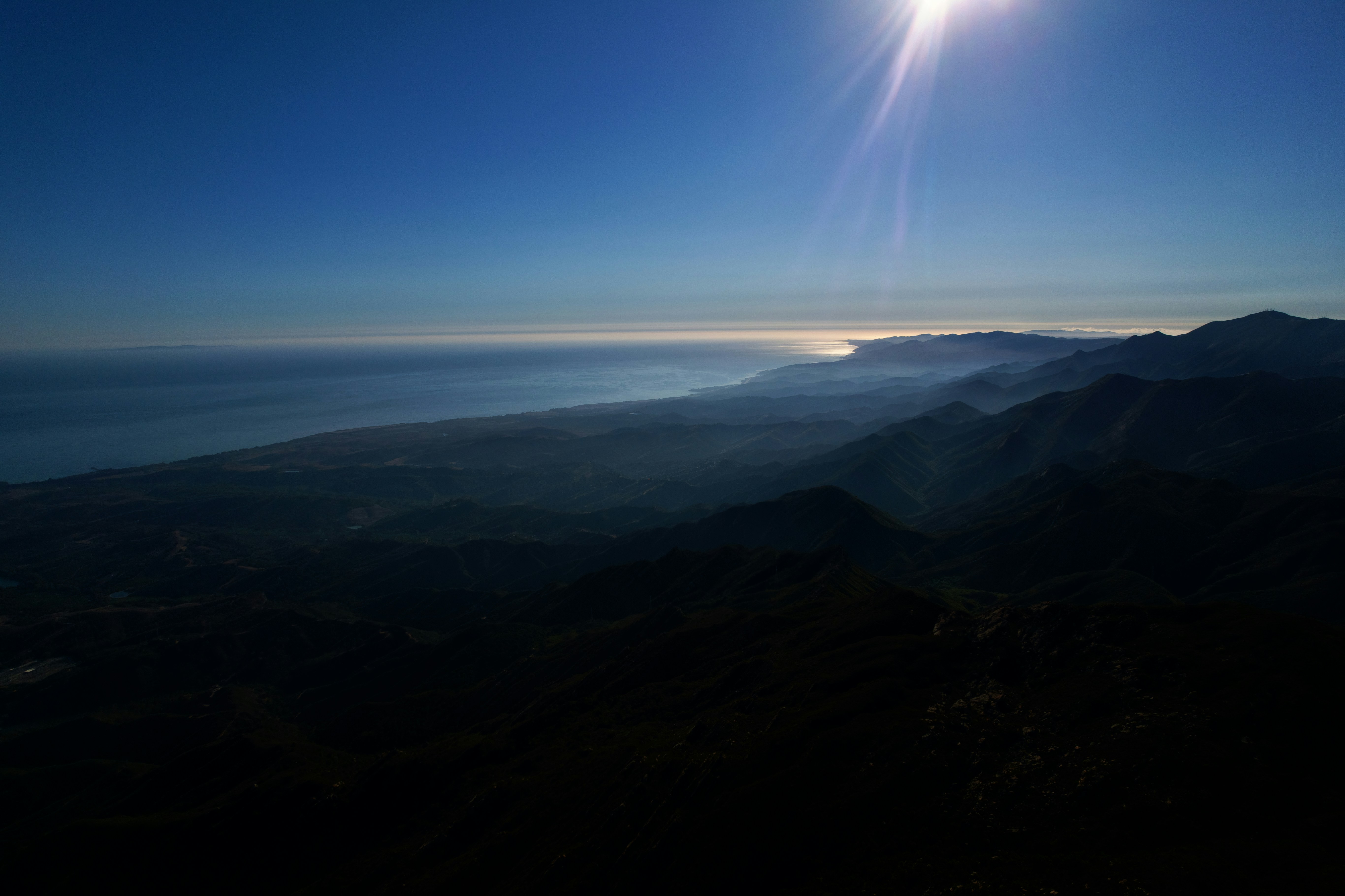 Sunlit Ridge Overlook: A Quiet Horizon Between Sea and Mountains