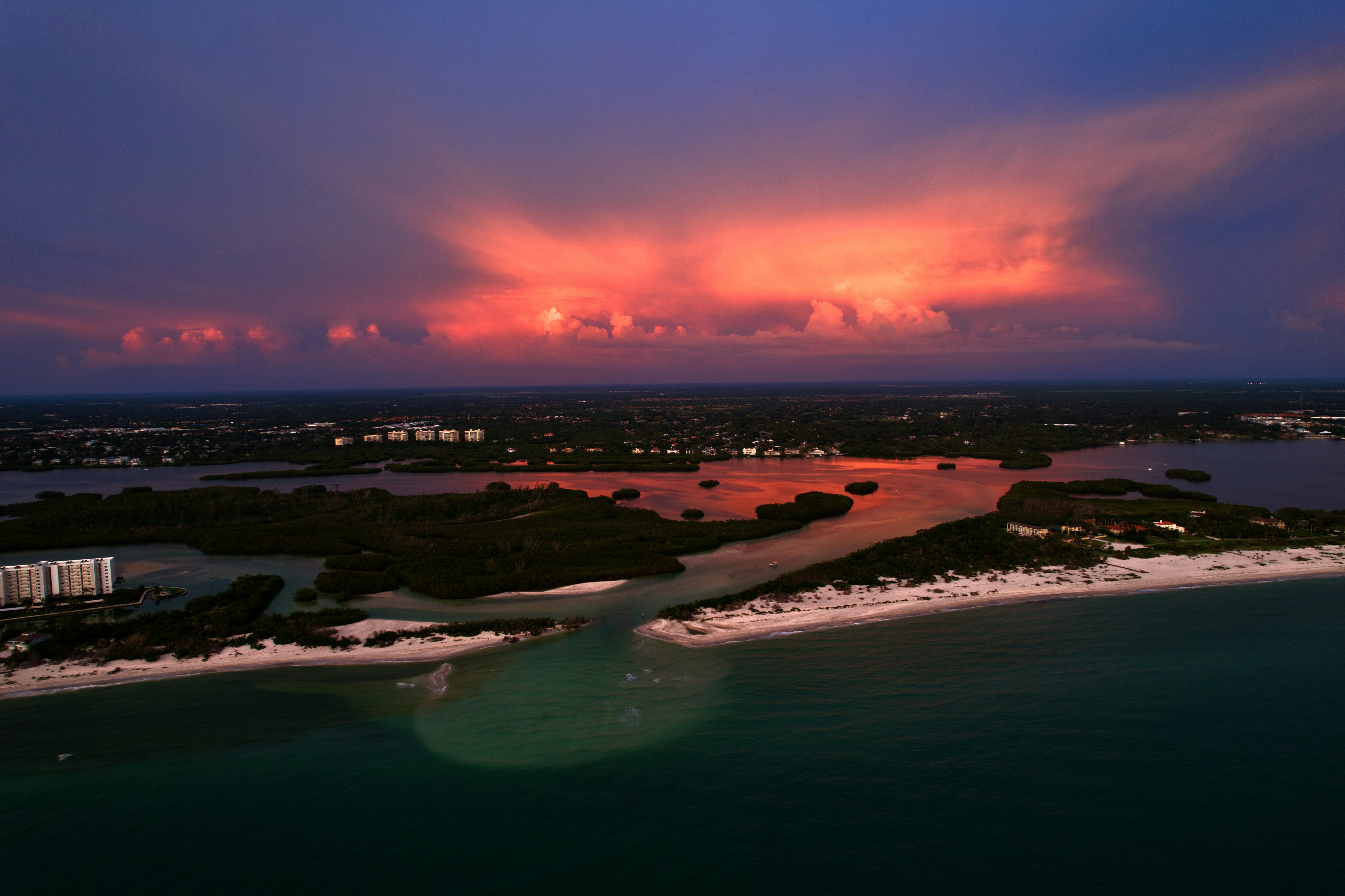 Sunset Over Coral Coastline: Aerial Quiet of Sand and Sea