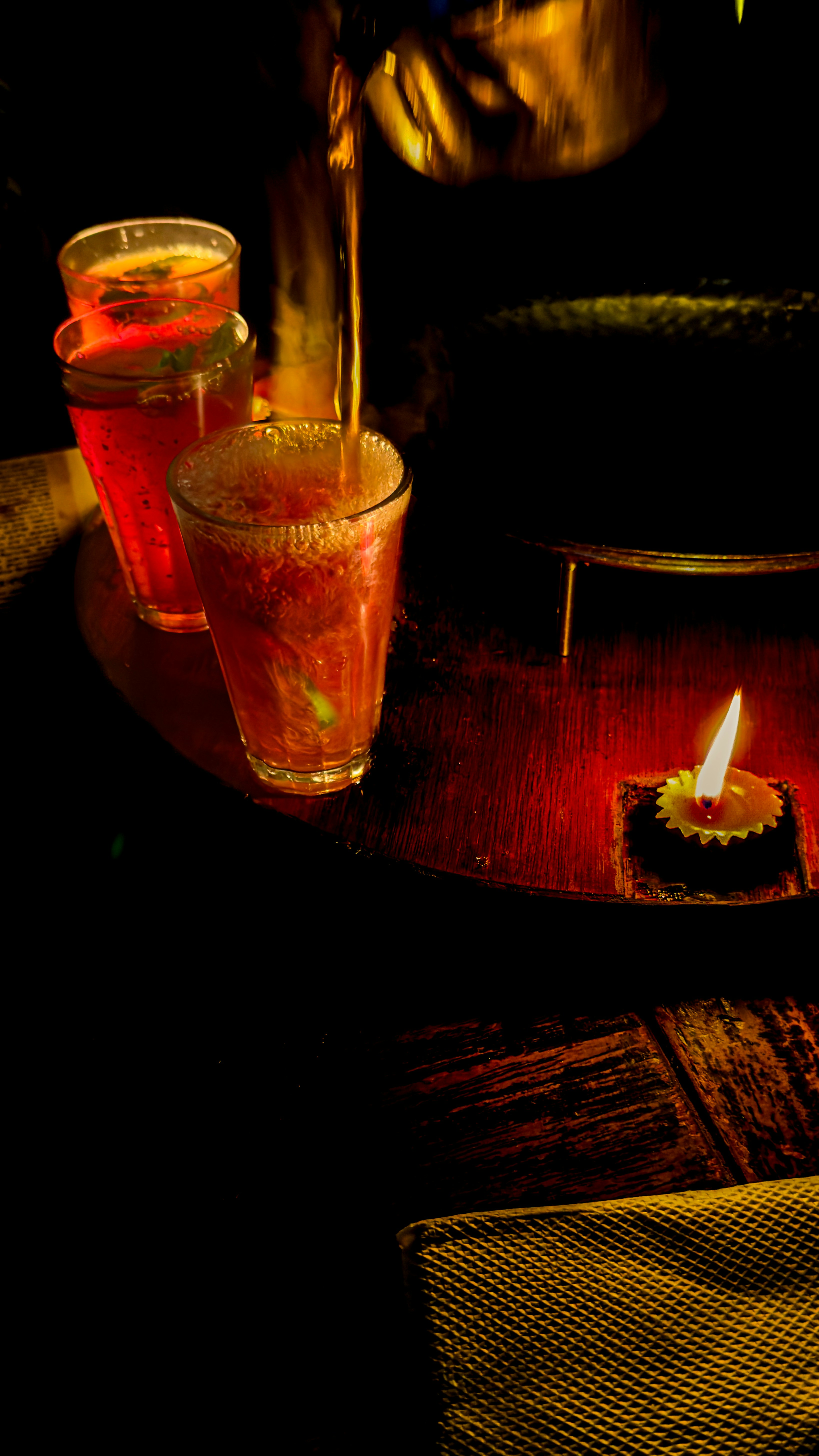Citrus Glow at the Bar: Moonlit drinks by a lone candle