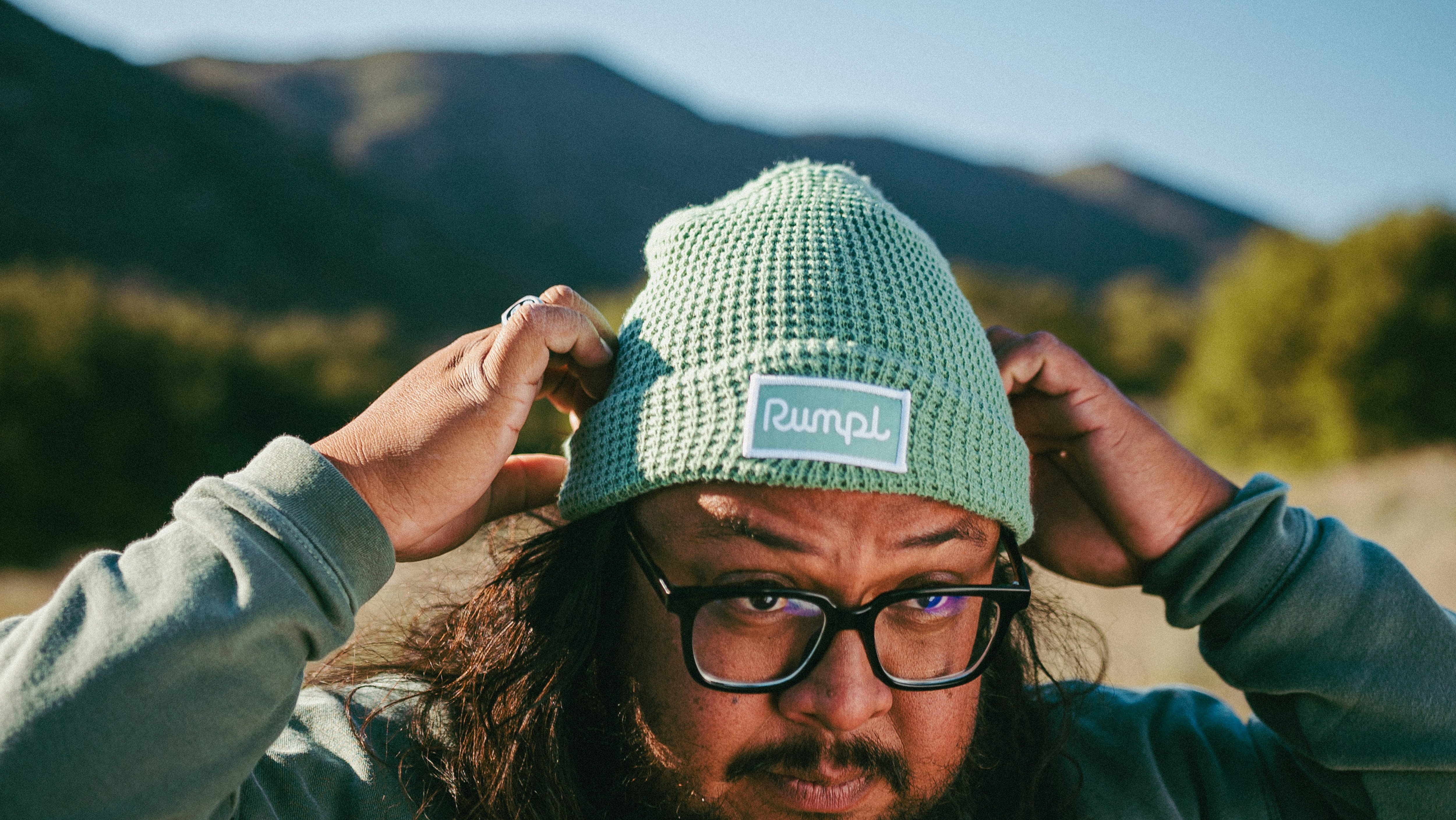 Glasses and Beanie: Focused Gaze in Mountain Light