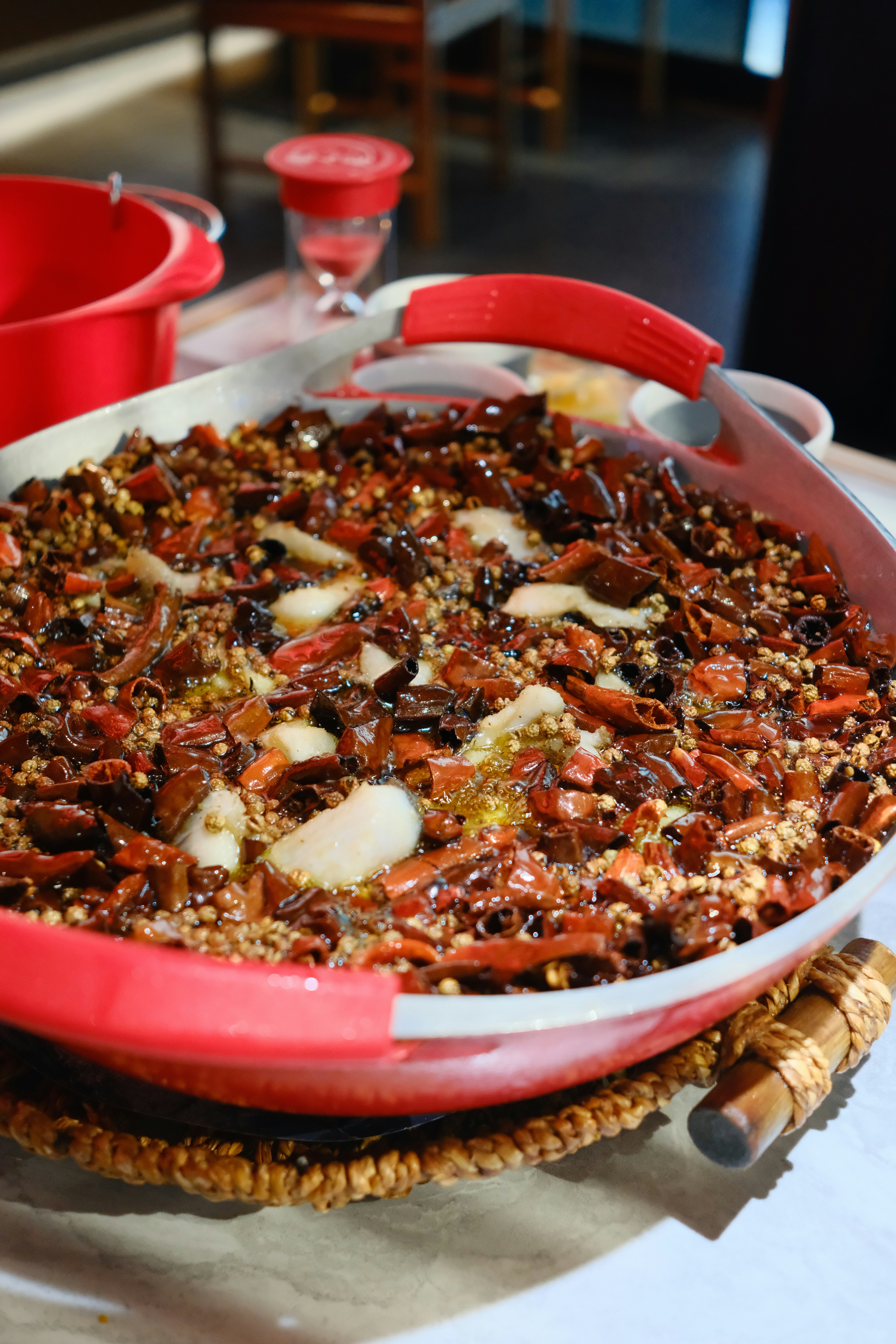 Red-Hued Pot: A Hearty Pepper-Pecan Pan in a Rustic Eatery