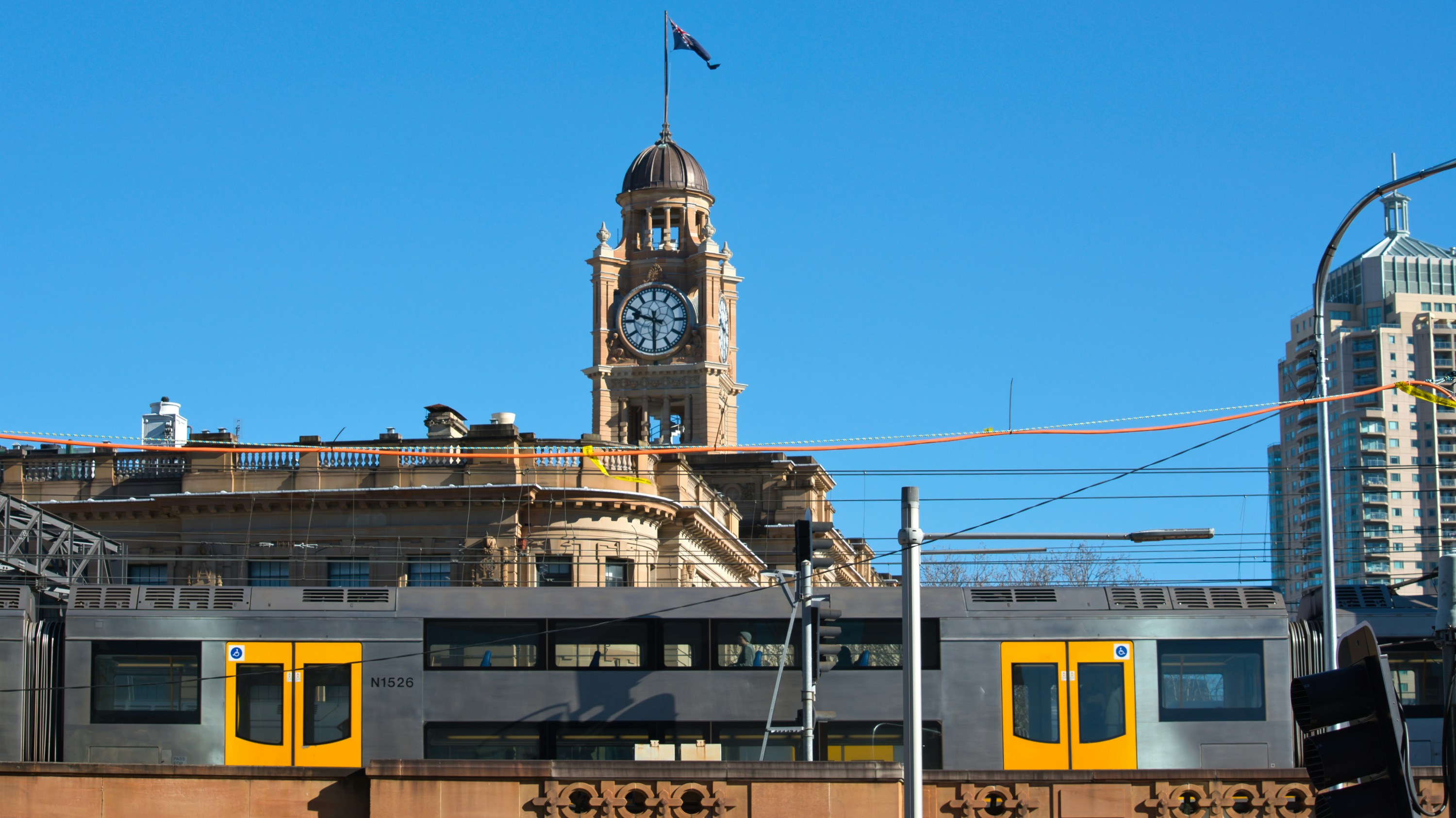 Clock Tower in Front of a Modern Trainscape