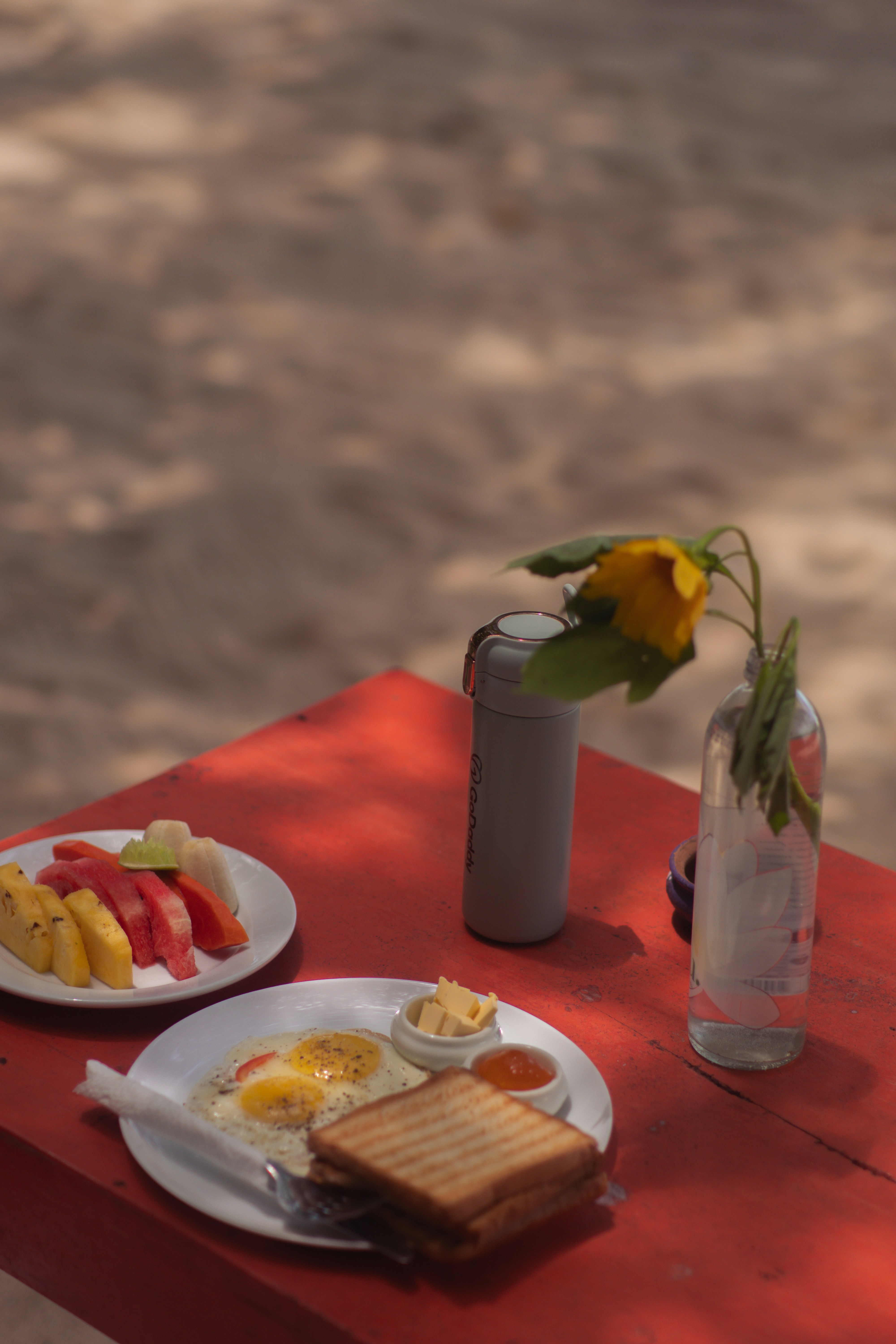 Sunlit Breakfast on a Red Table