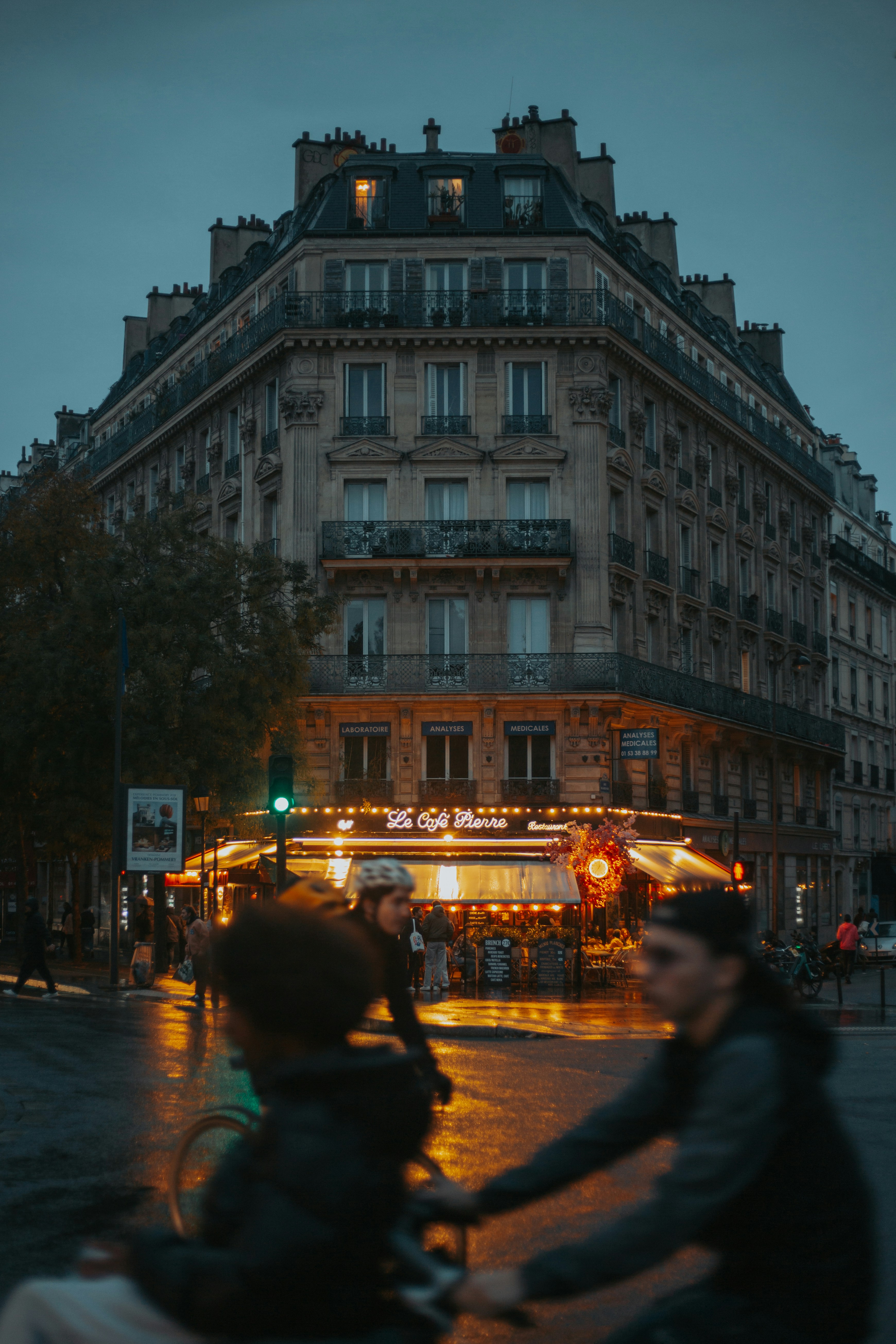 Evening Café Glow on a Parisian Street Corner