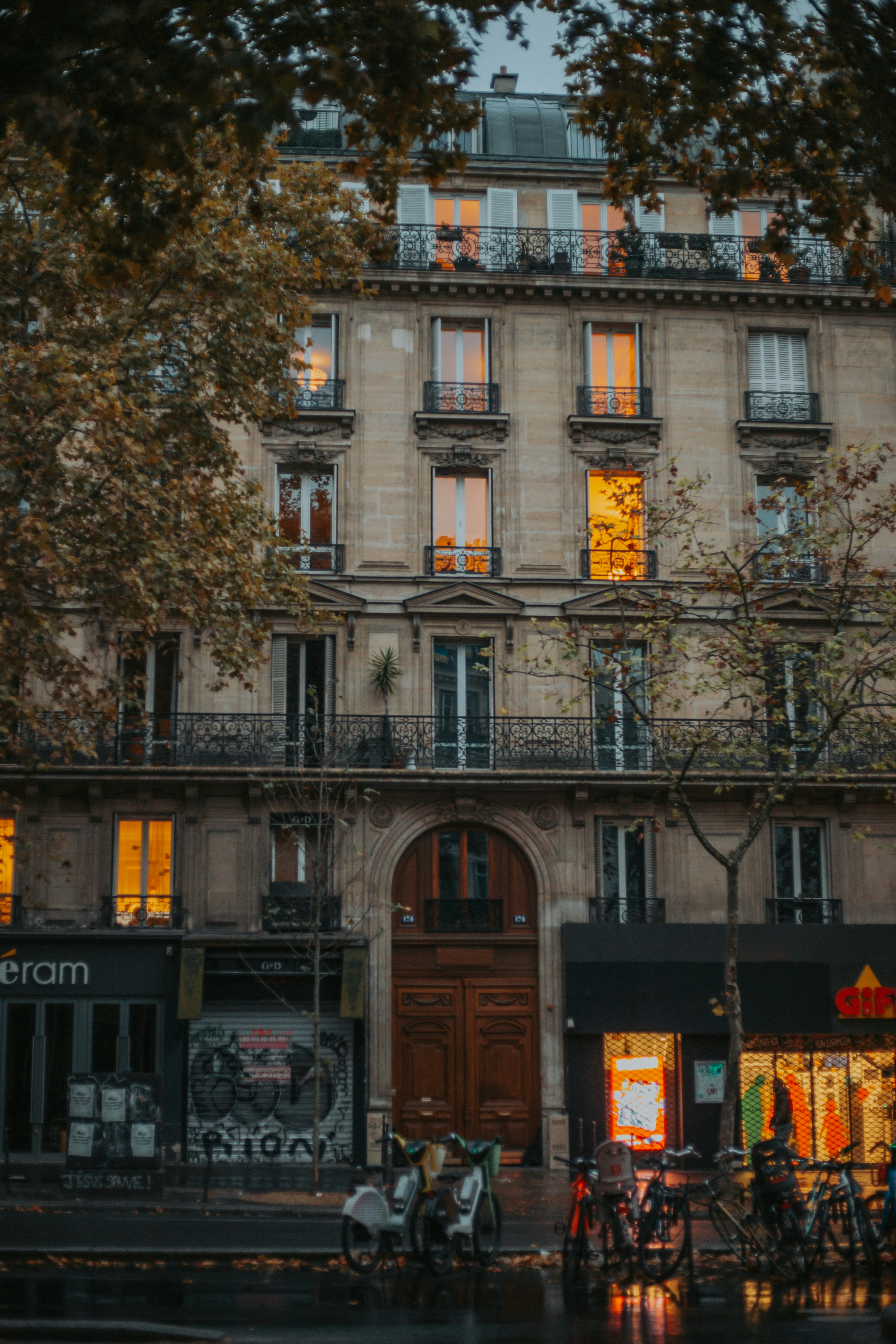 Sunlit Orange Reflections in a Parisian Façade