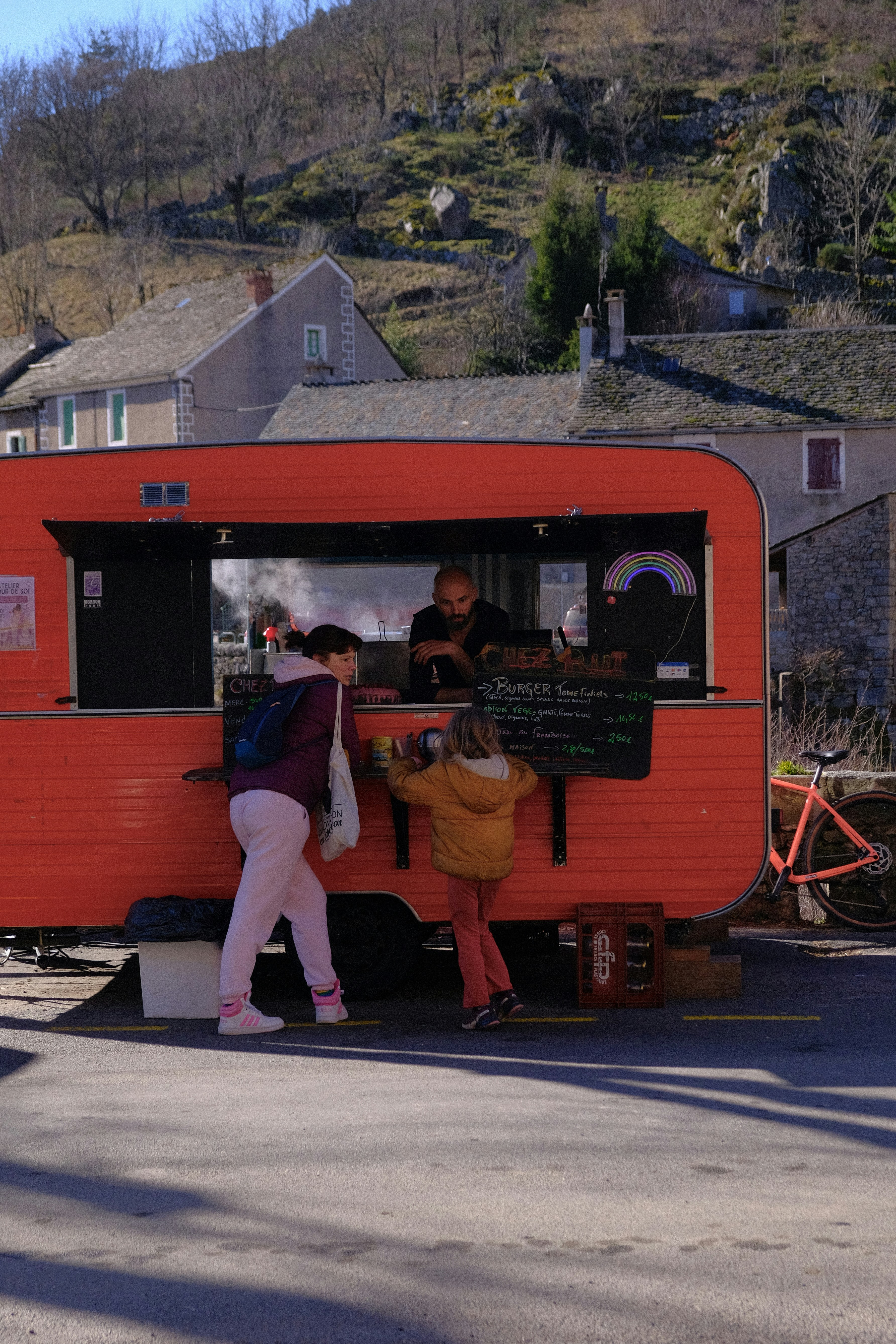 Bright-Orange Food Truck Brews Interaction Between Staff and Customers