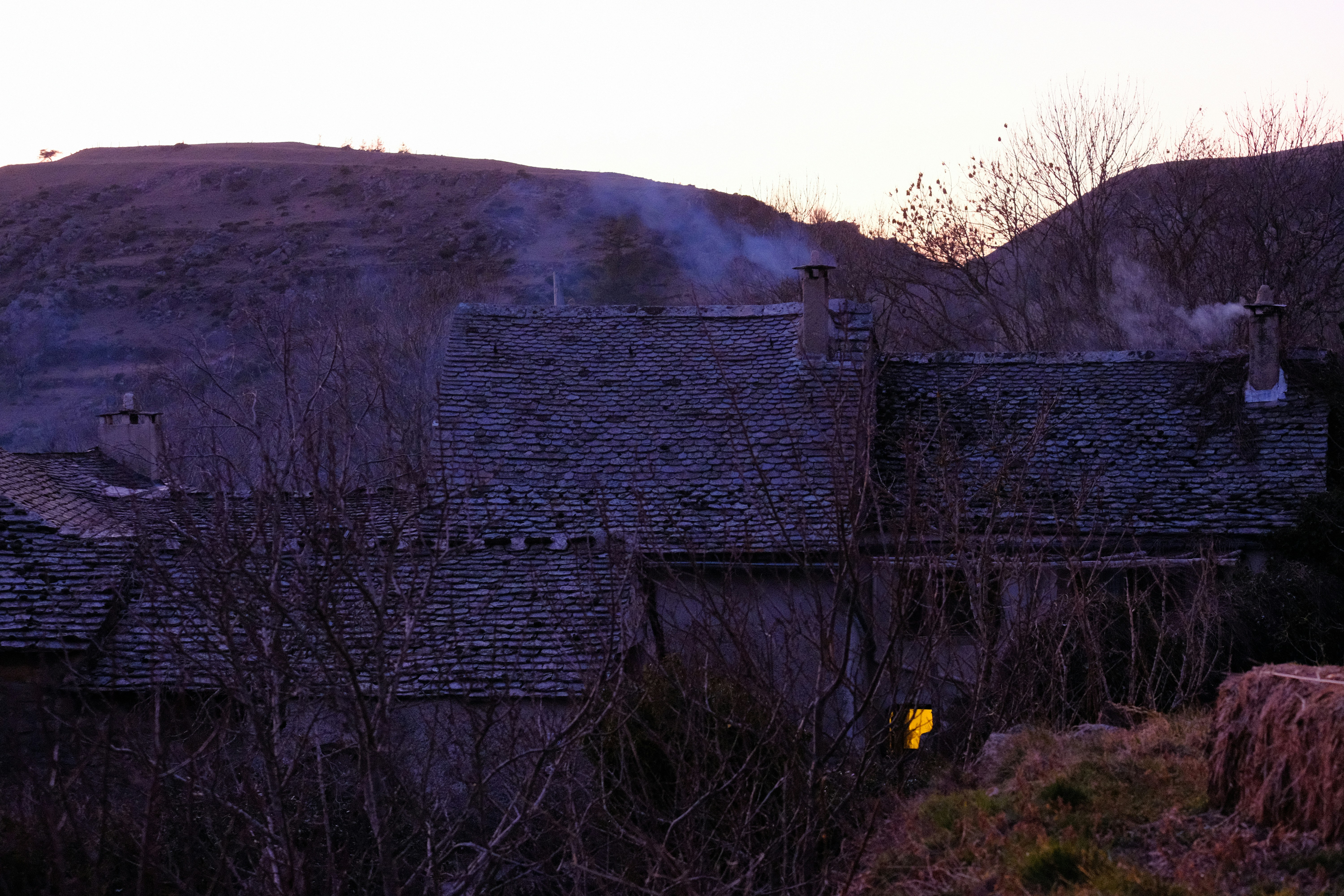 Moonlit Village Ridge with Steam over Rooftops