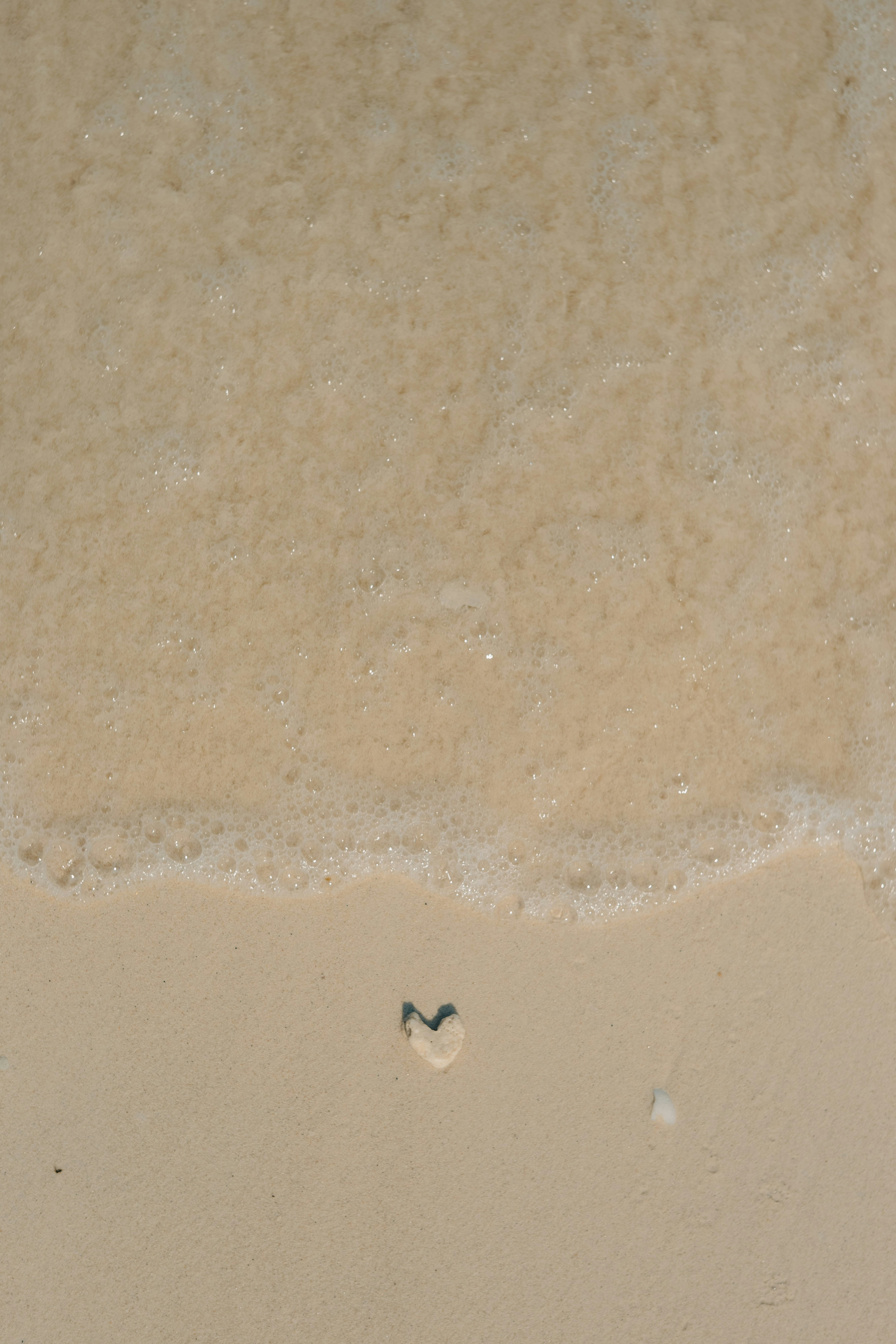 Heart in the Tide: A Tiny Sandmark at the Shore