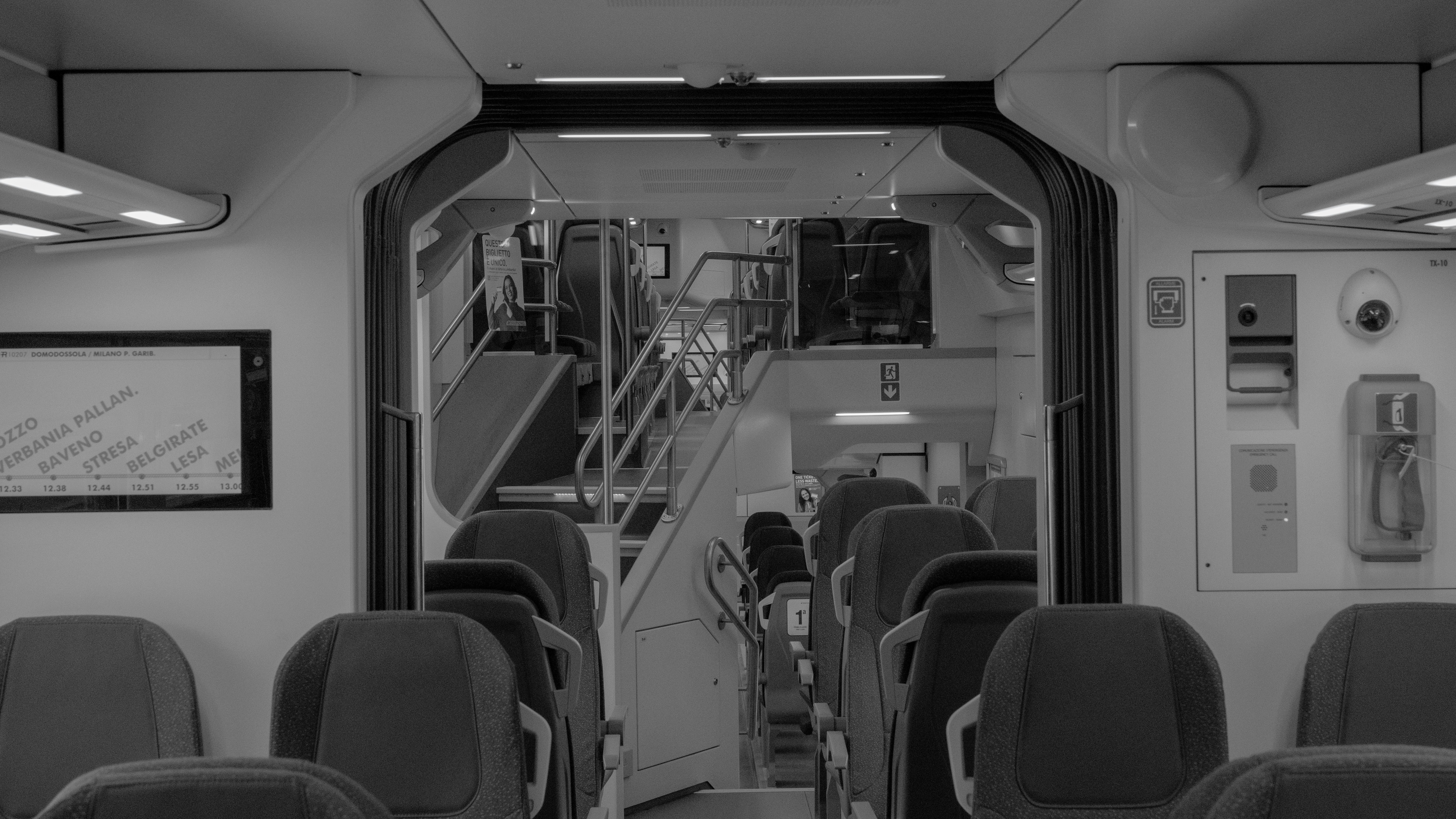 Mid-Aisle Quiet: An Empty Passenger Bus Stages the Road Ahead