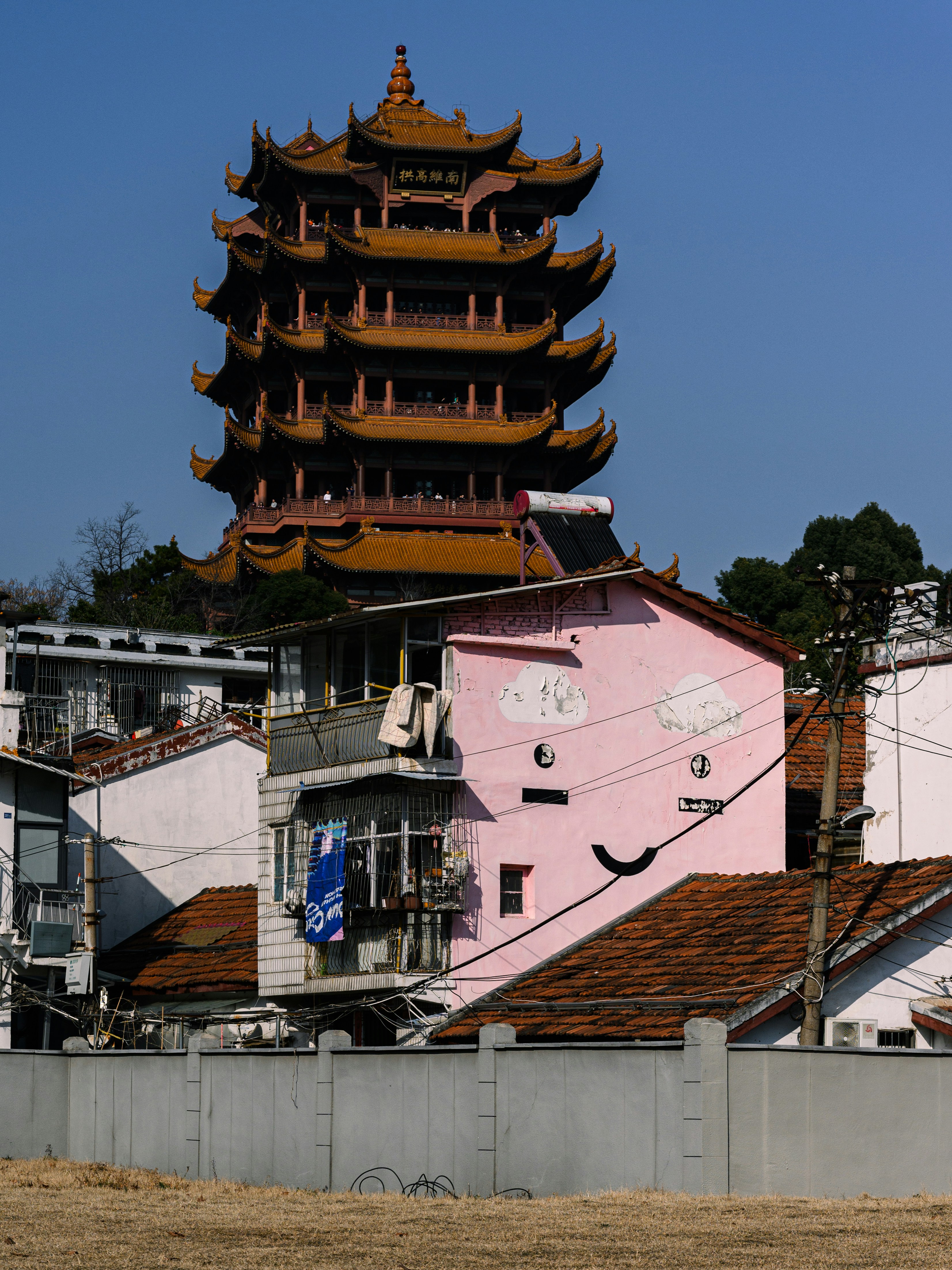 The Pink Wall Gazer: A City Studio Reveals a Laughing Facade