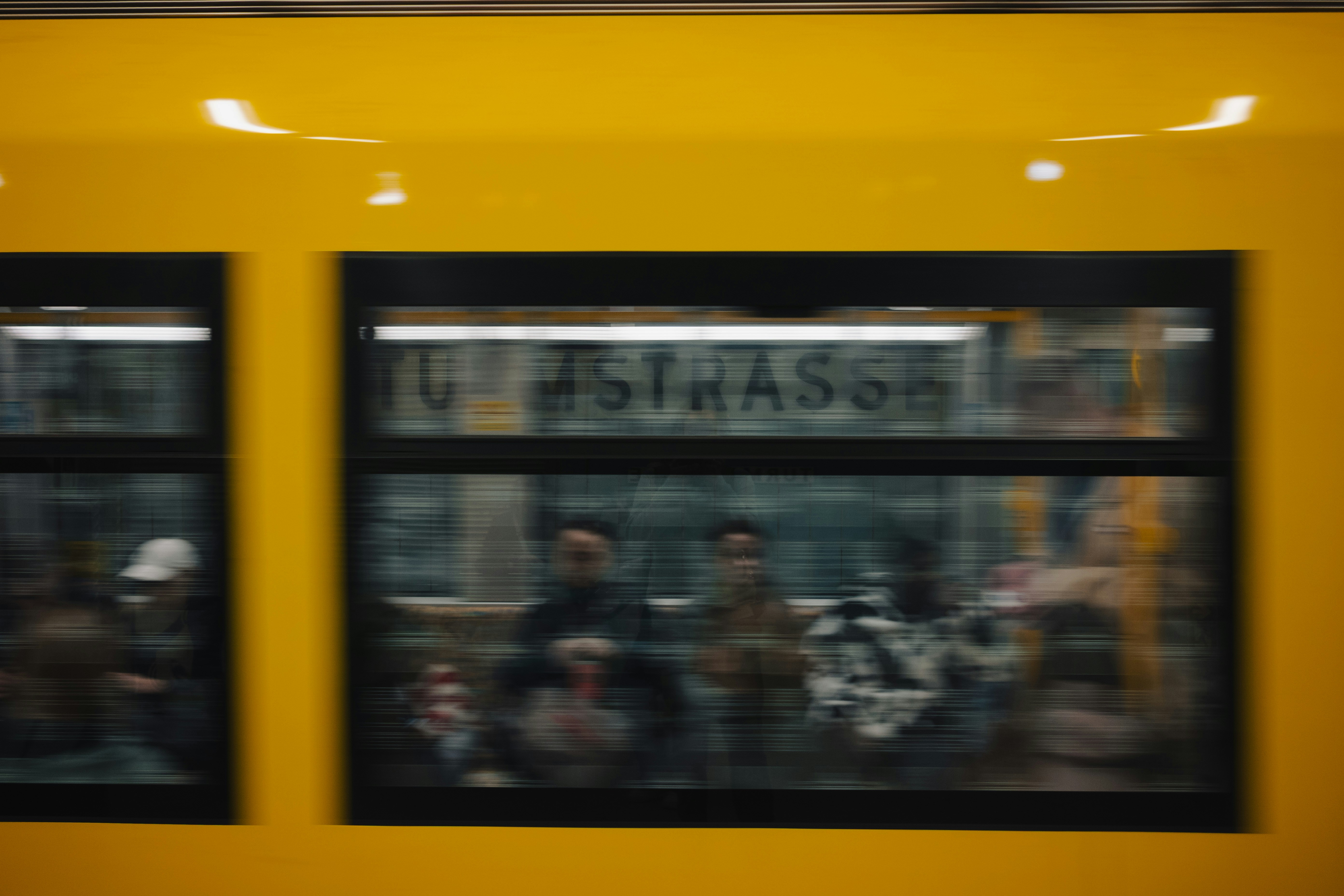 Blurry Streetcar Blues: A Fleeting Glimpse Through the Yellow Window
