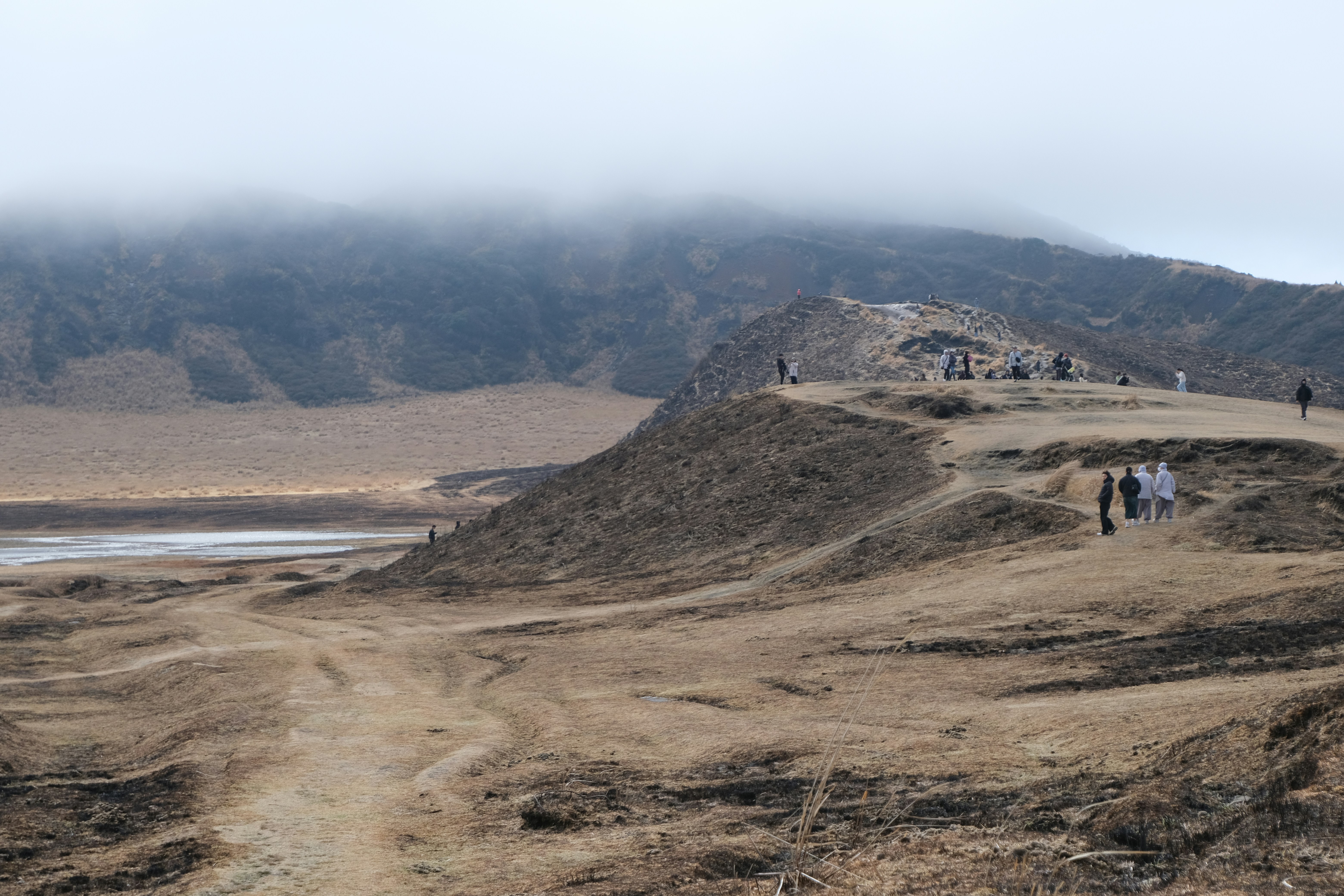 Hiker's Outpost atop a wind-swept ridge under muted skies