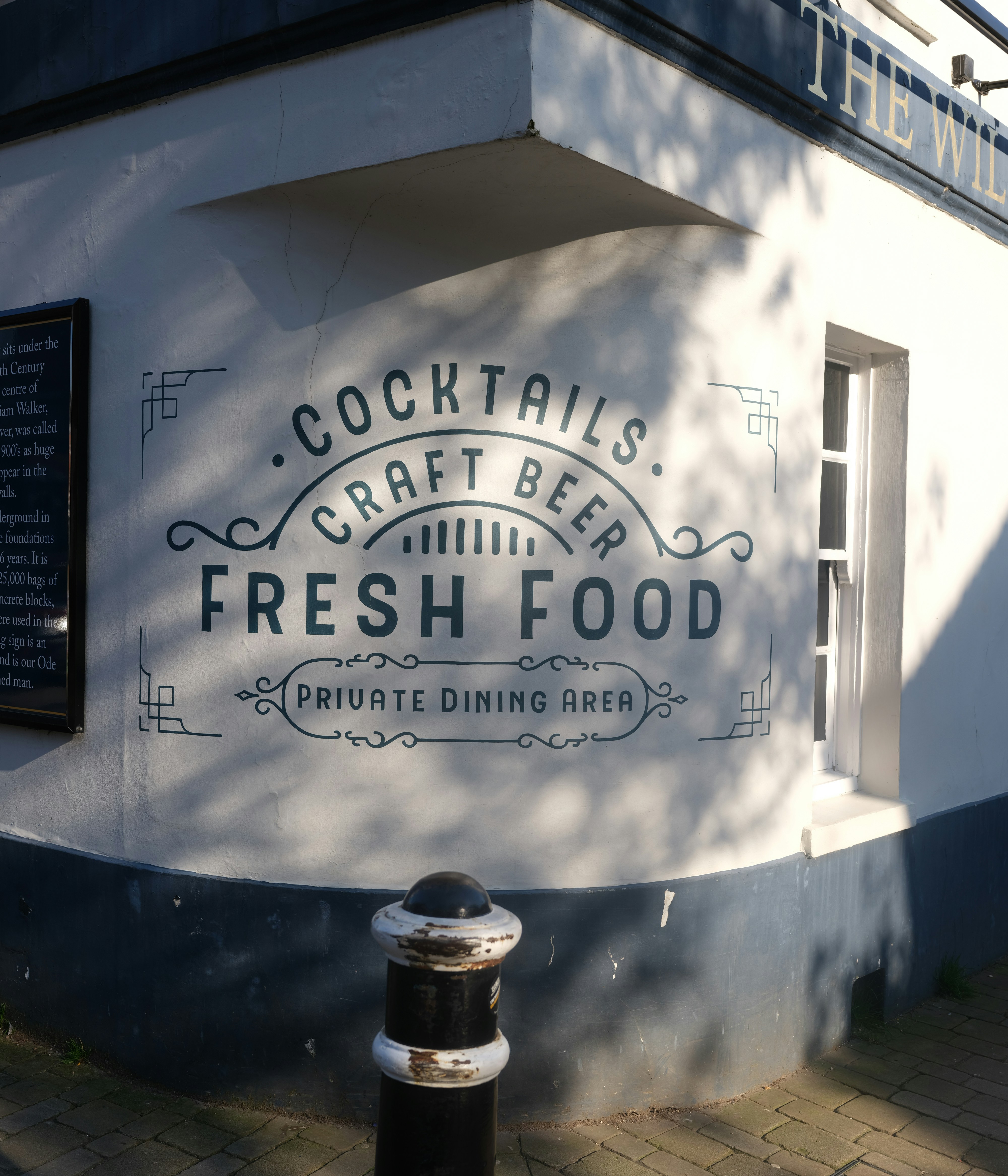 Fresh Food Signage on Corner Cafe Wall