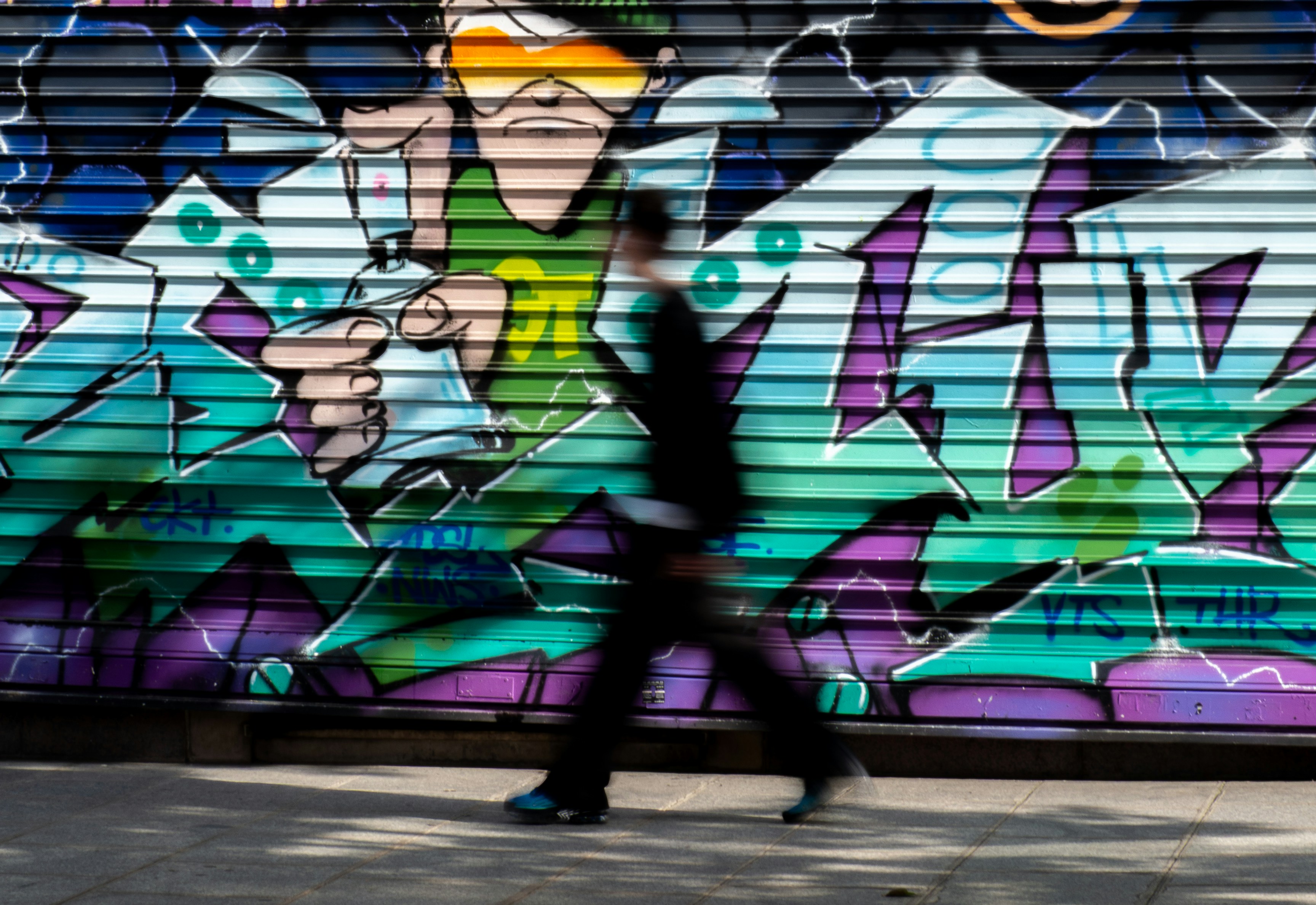 Graffiti Runner in Front of Colorful Wall Mural