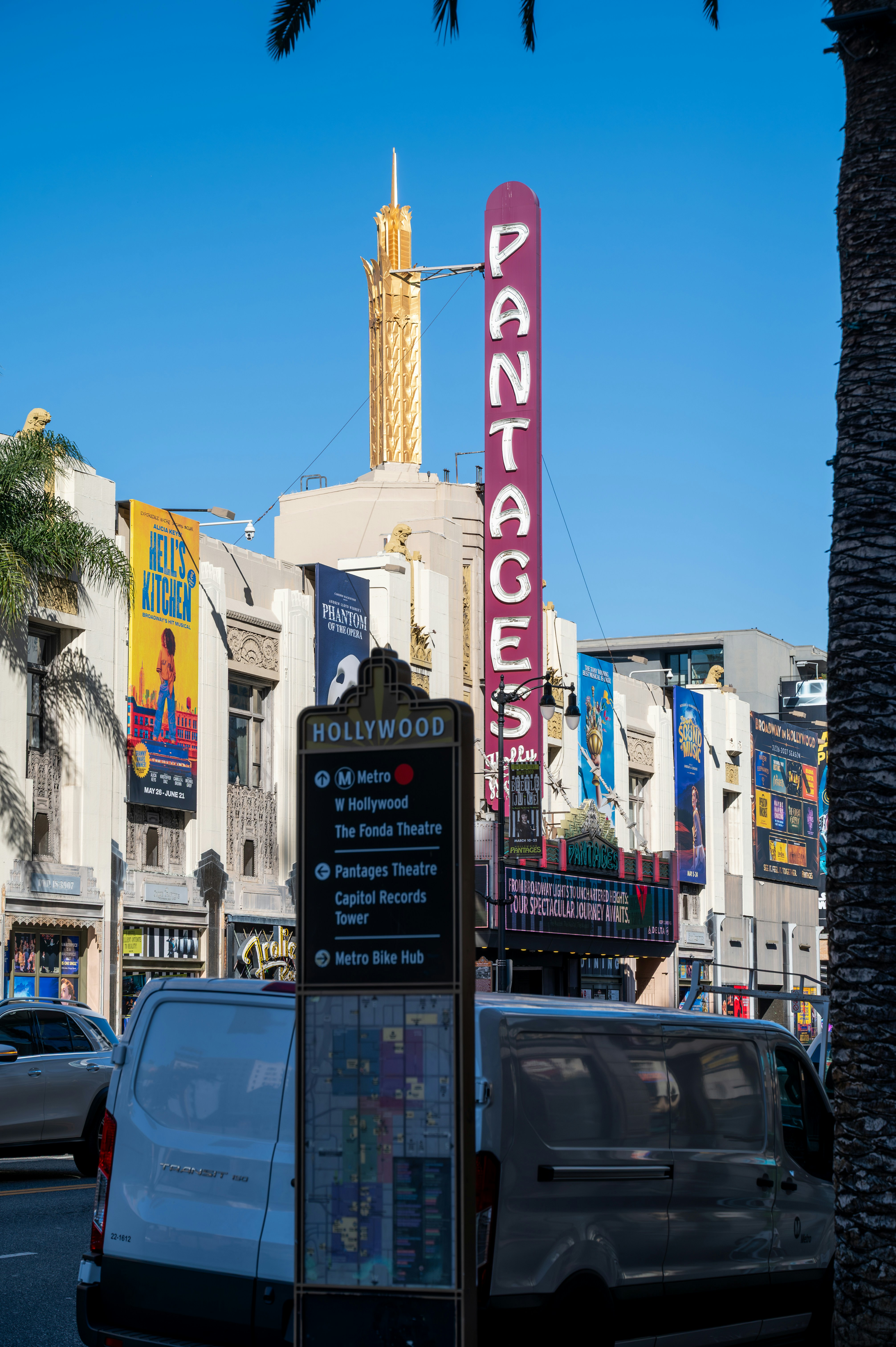 Neon Pillars and Palm Shadows on Hollywood Boulevard