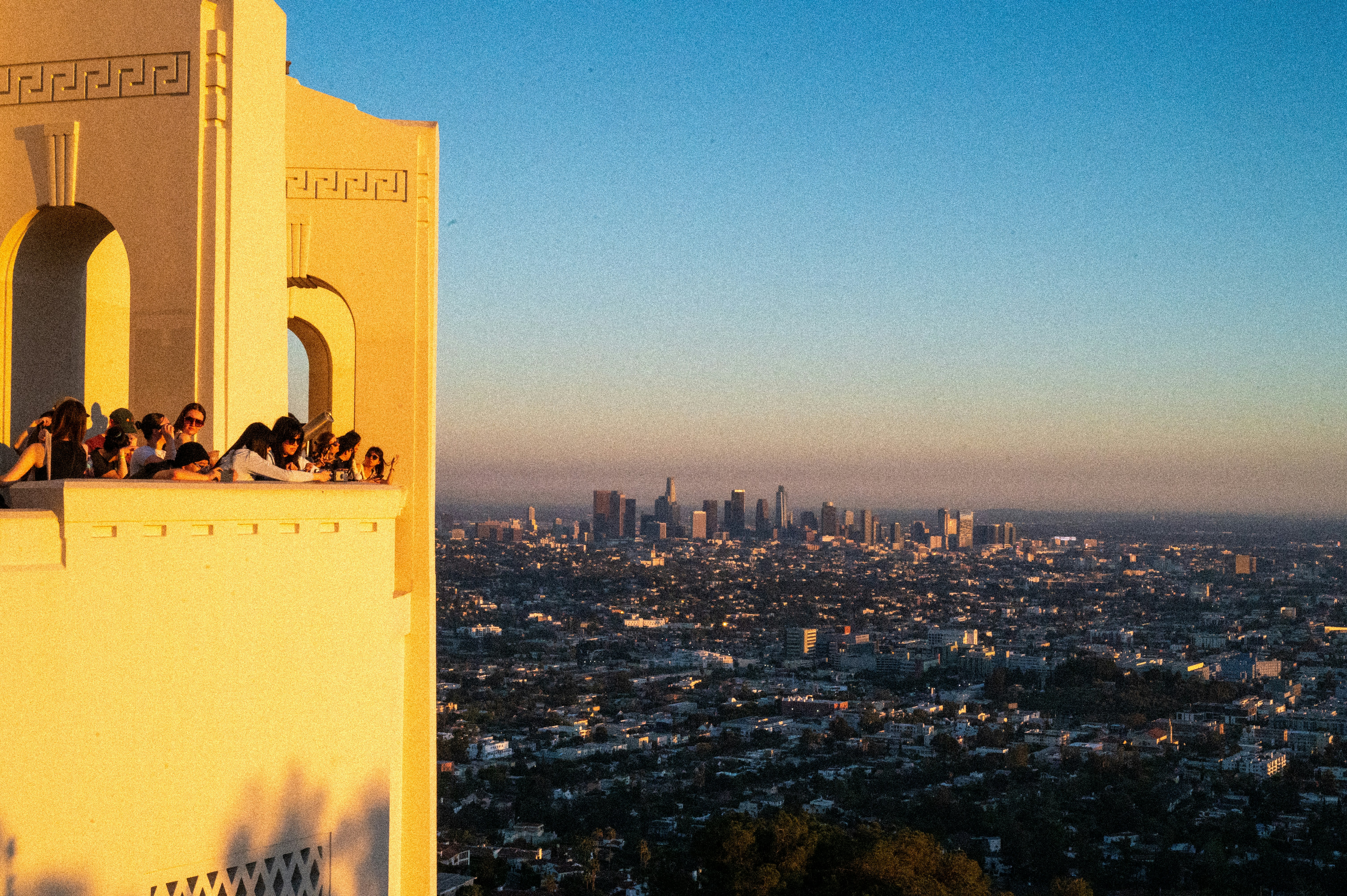 Sunlit Terrace Over Los Angeles: A Balcony Watcher at Golden Hour