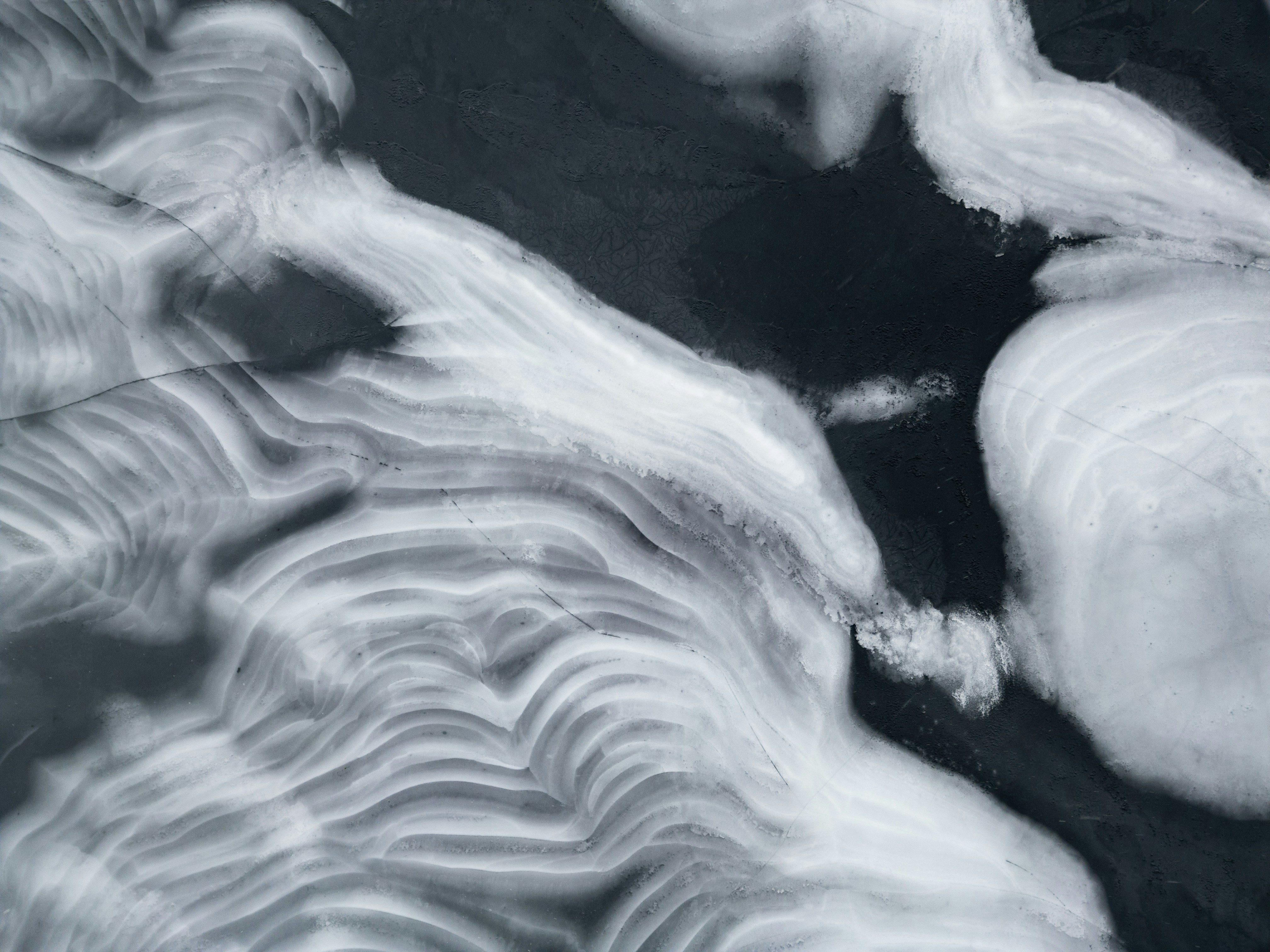 Swirling Glacier Crinkles: An Abstract Black-and-White Landscape