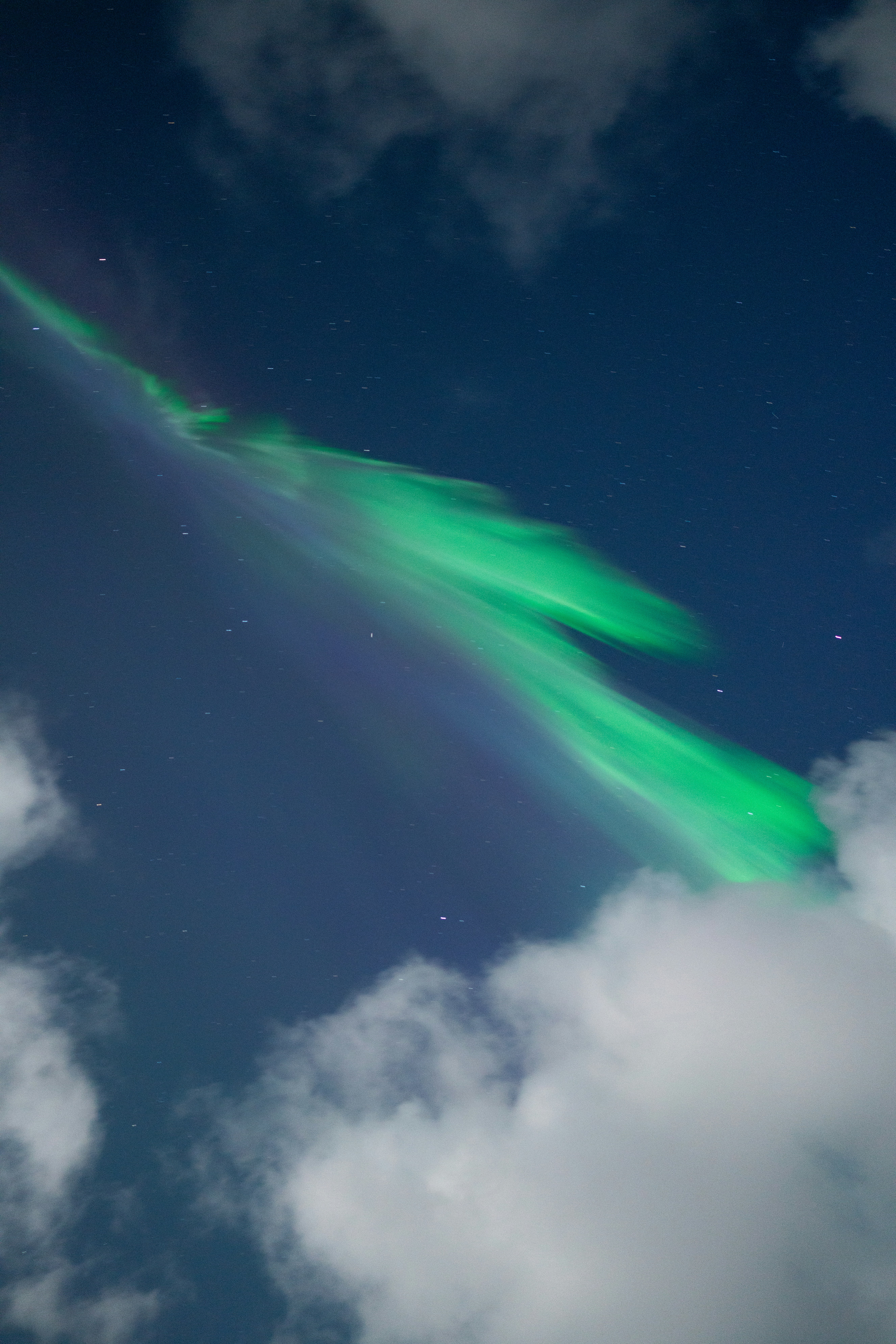 Aurora Trail Across a Starry Night