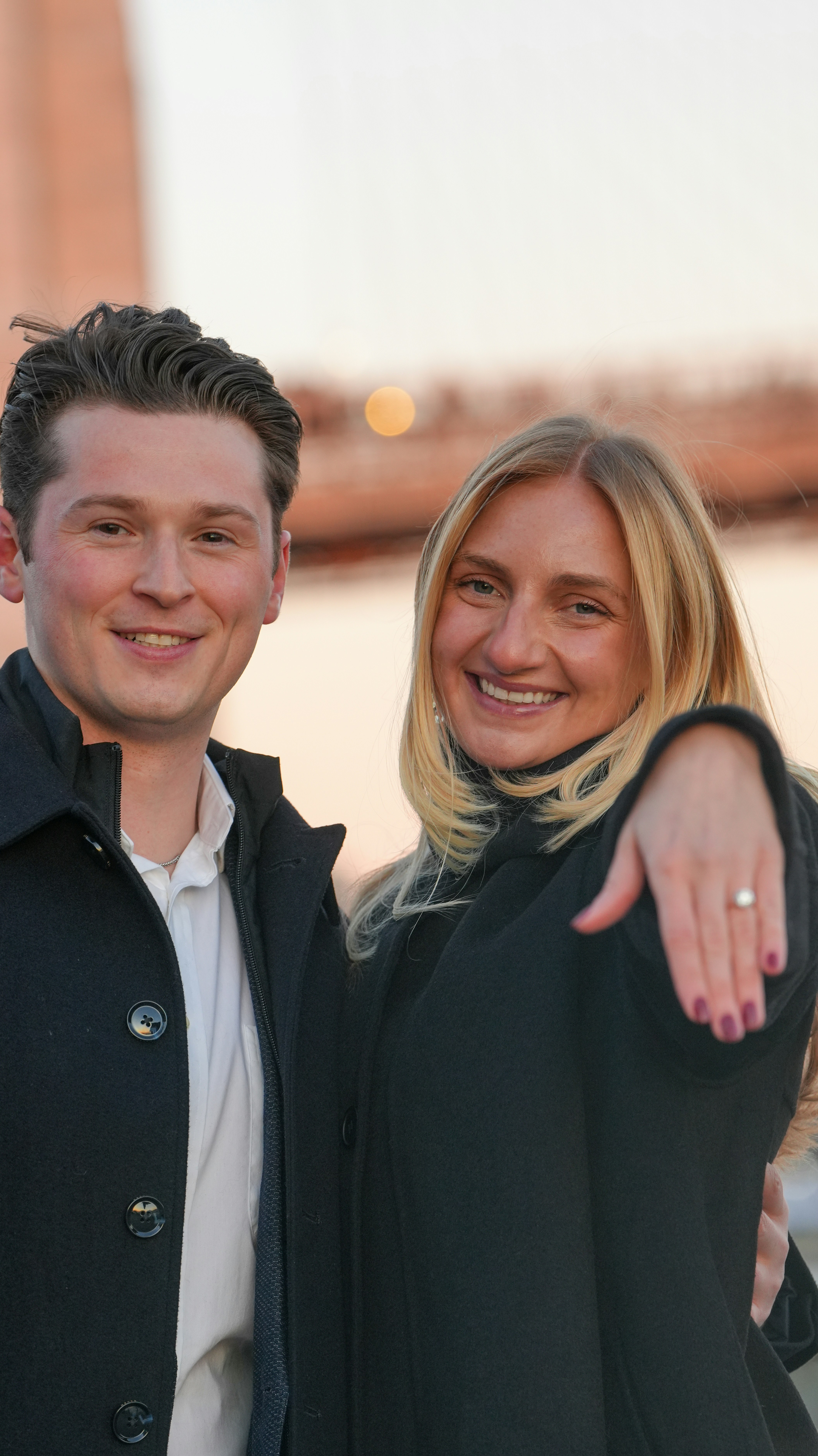 Two smiles, one sunset embrace
