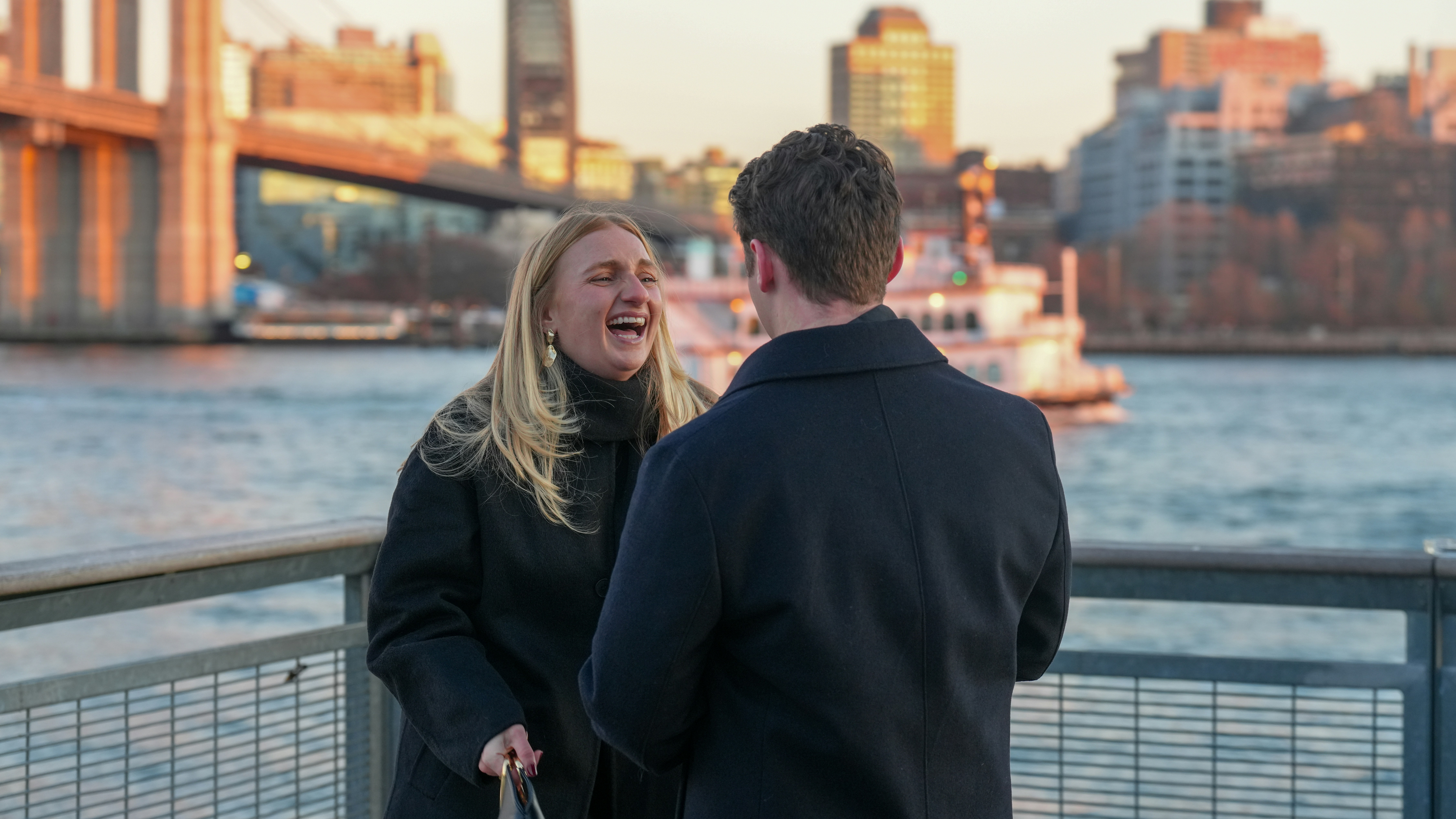Laughter by the River: A candid moment on the waterfront