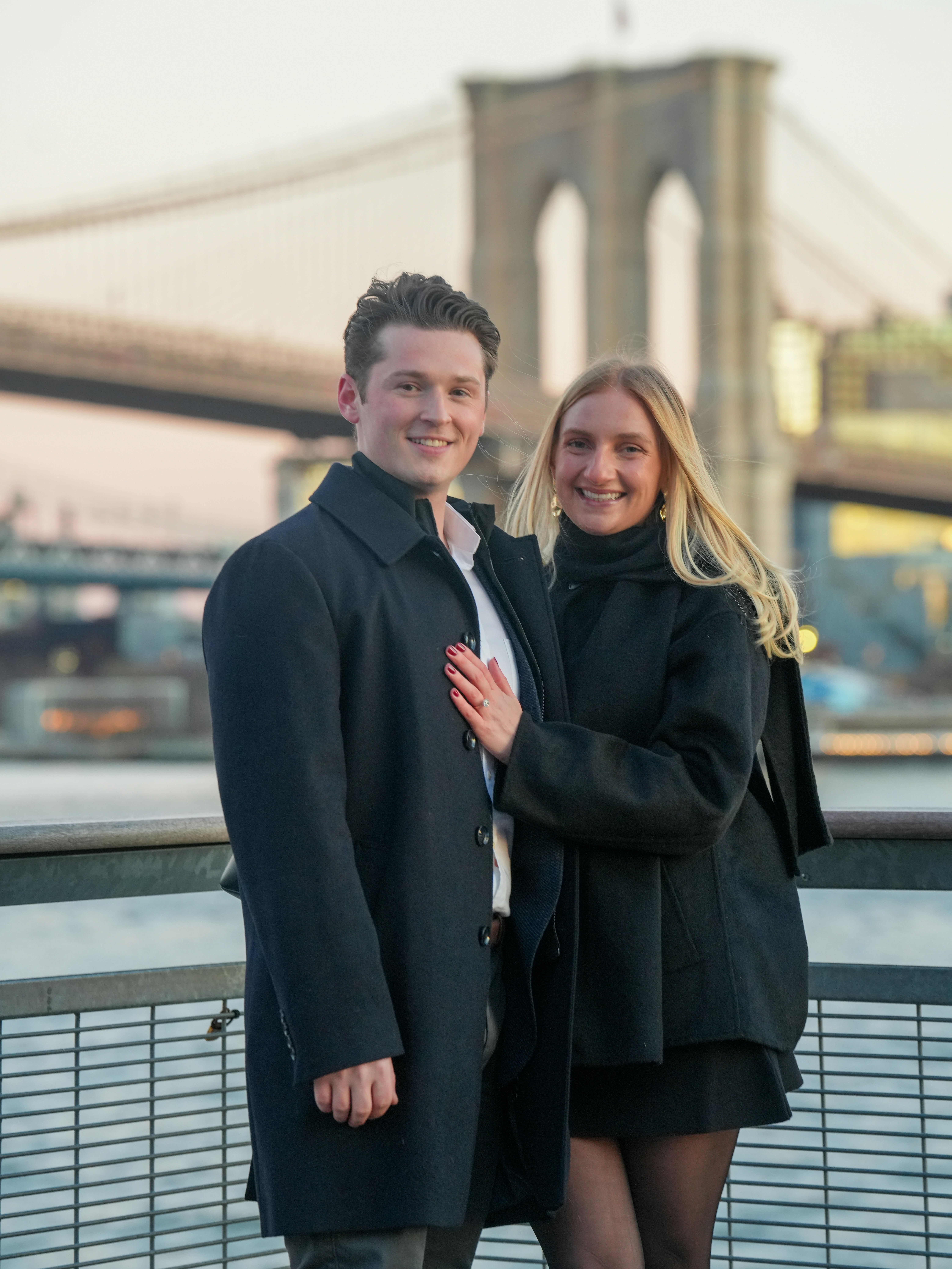 Two in the City: A Quiet Moment by the Bridge