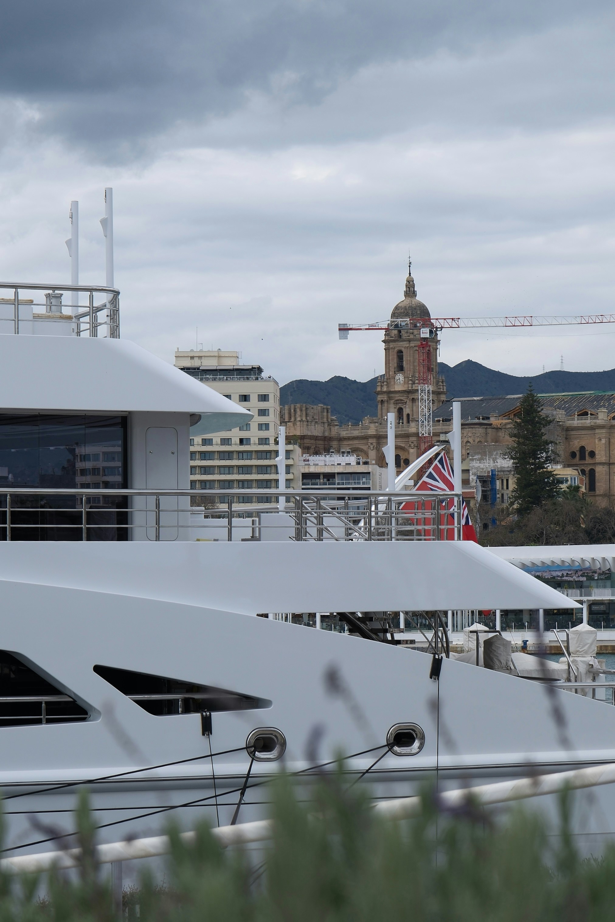Harbor Vessel Framed by Historic Cityscape