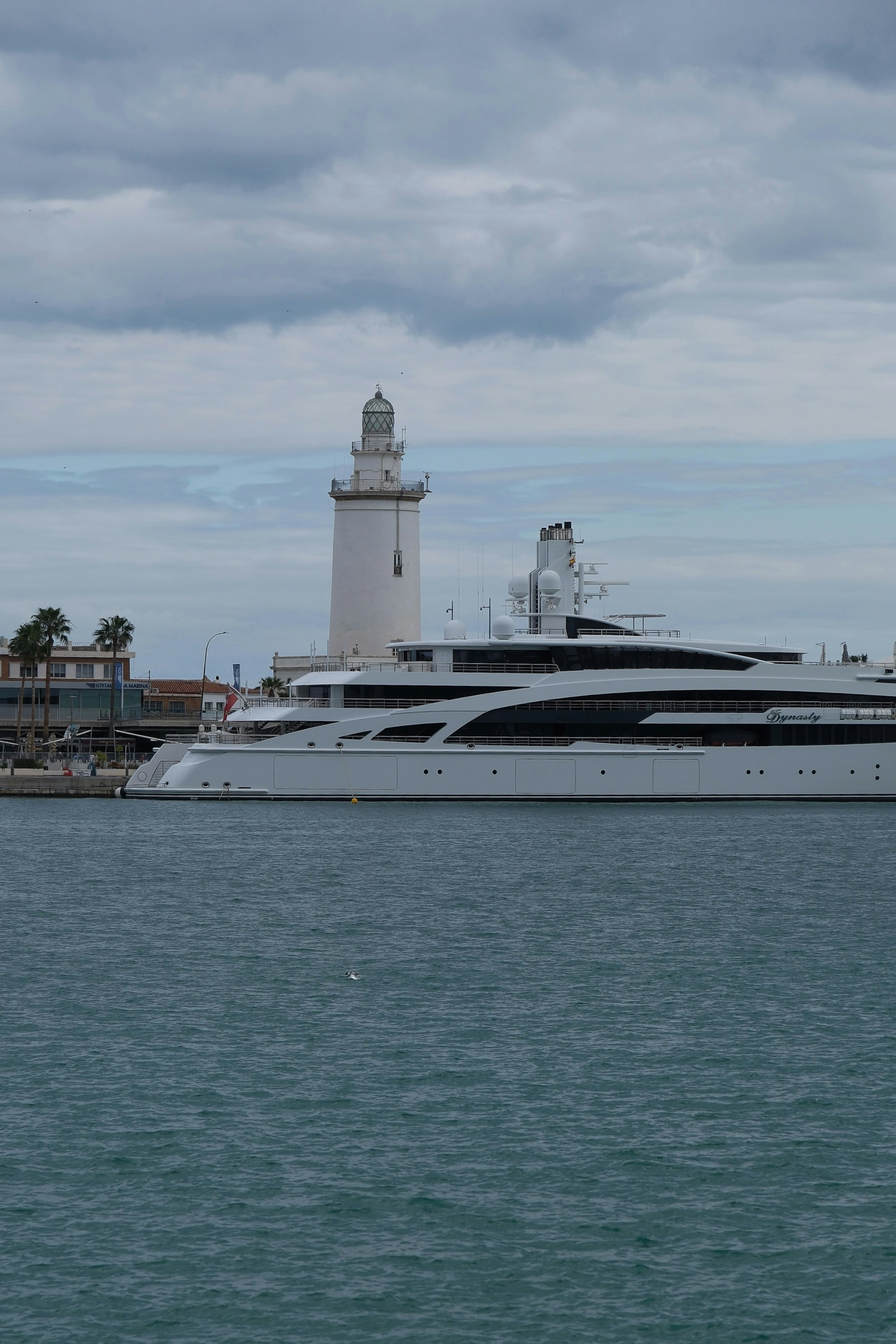 Marina Beacon: A Grand Yacht by the Lighthouse