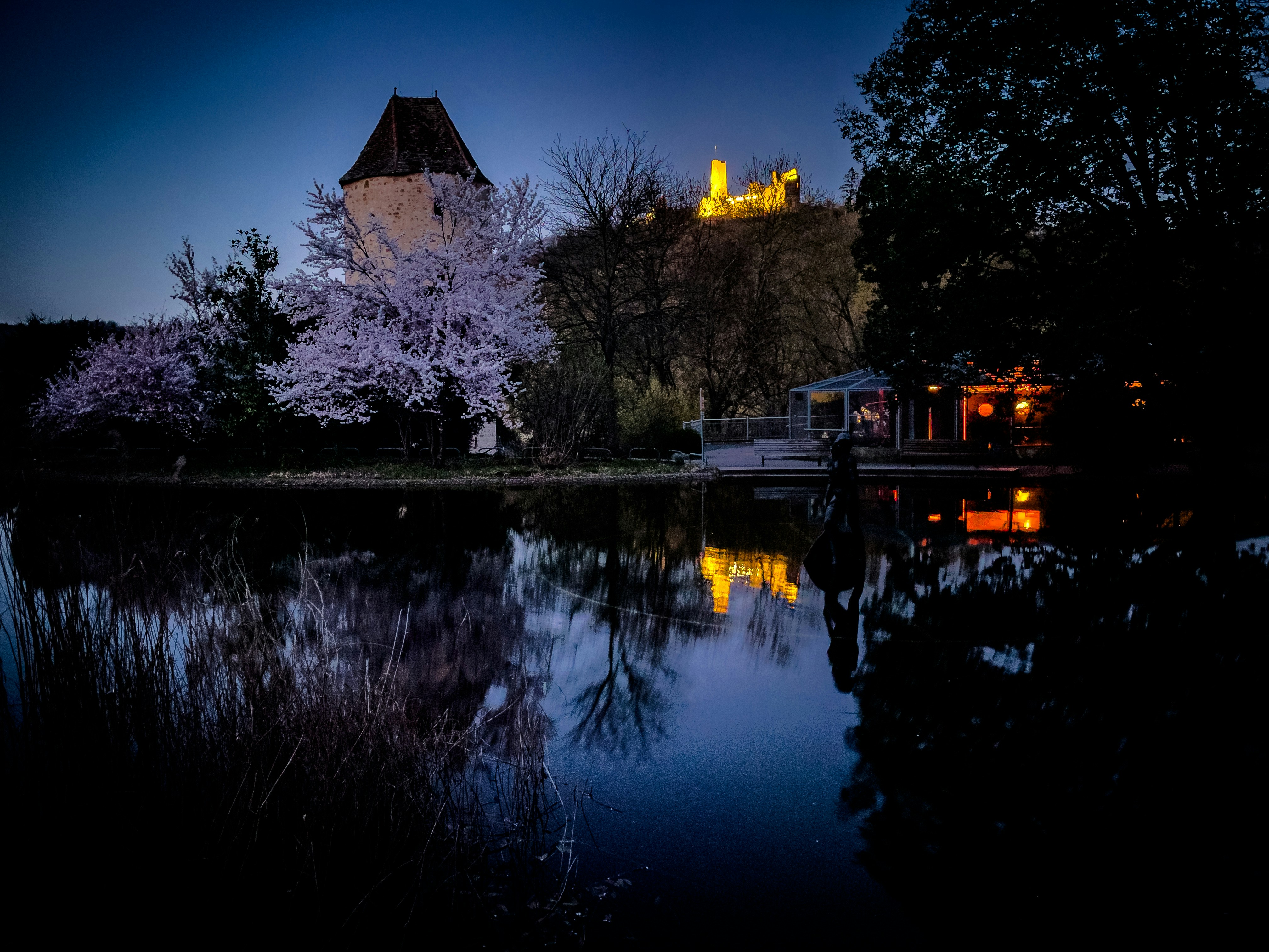 Moonlit Keep Reflections: A Quiet Night by the Lake