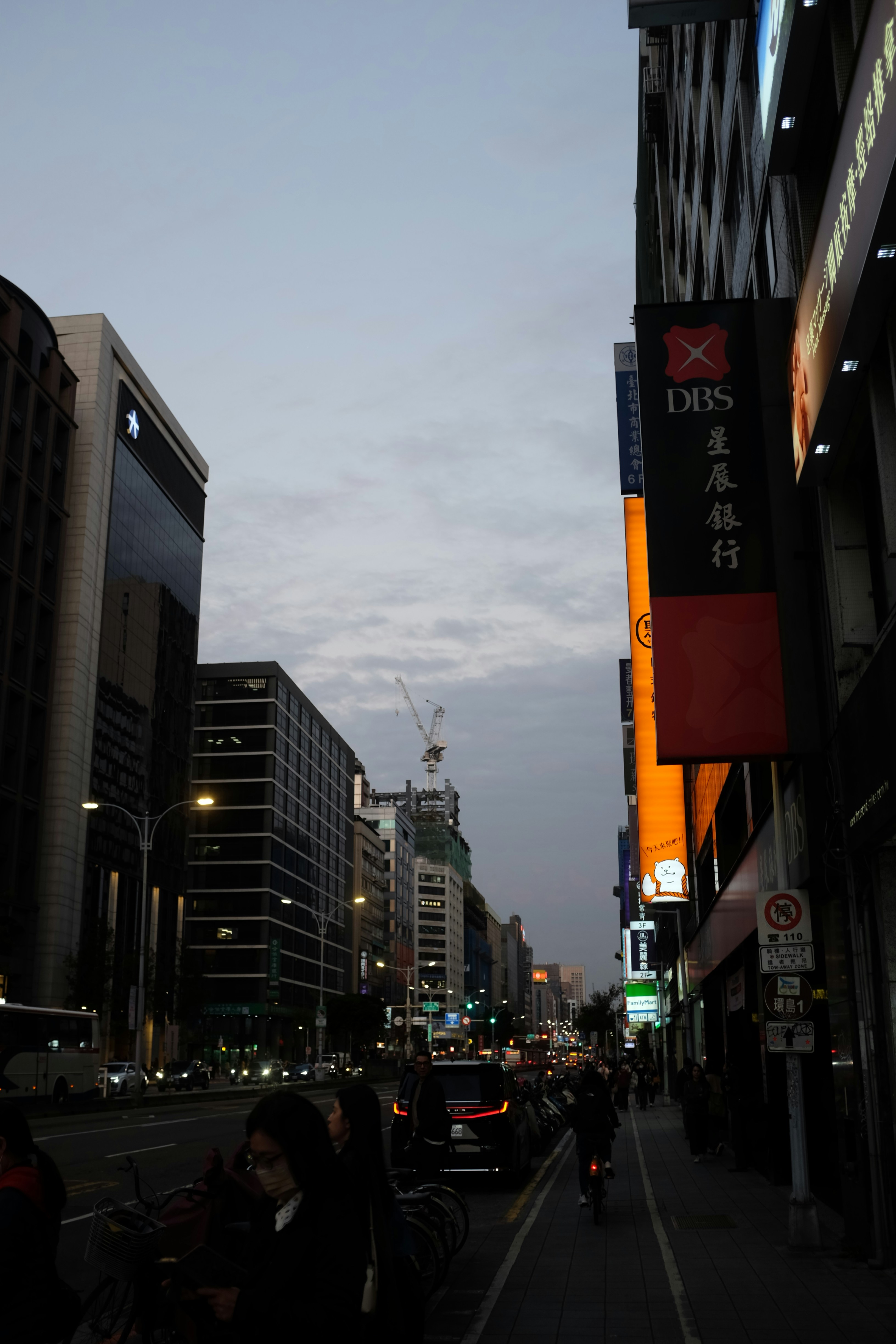Neon Vertical Signage and Dusk Street Corridor