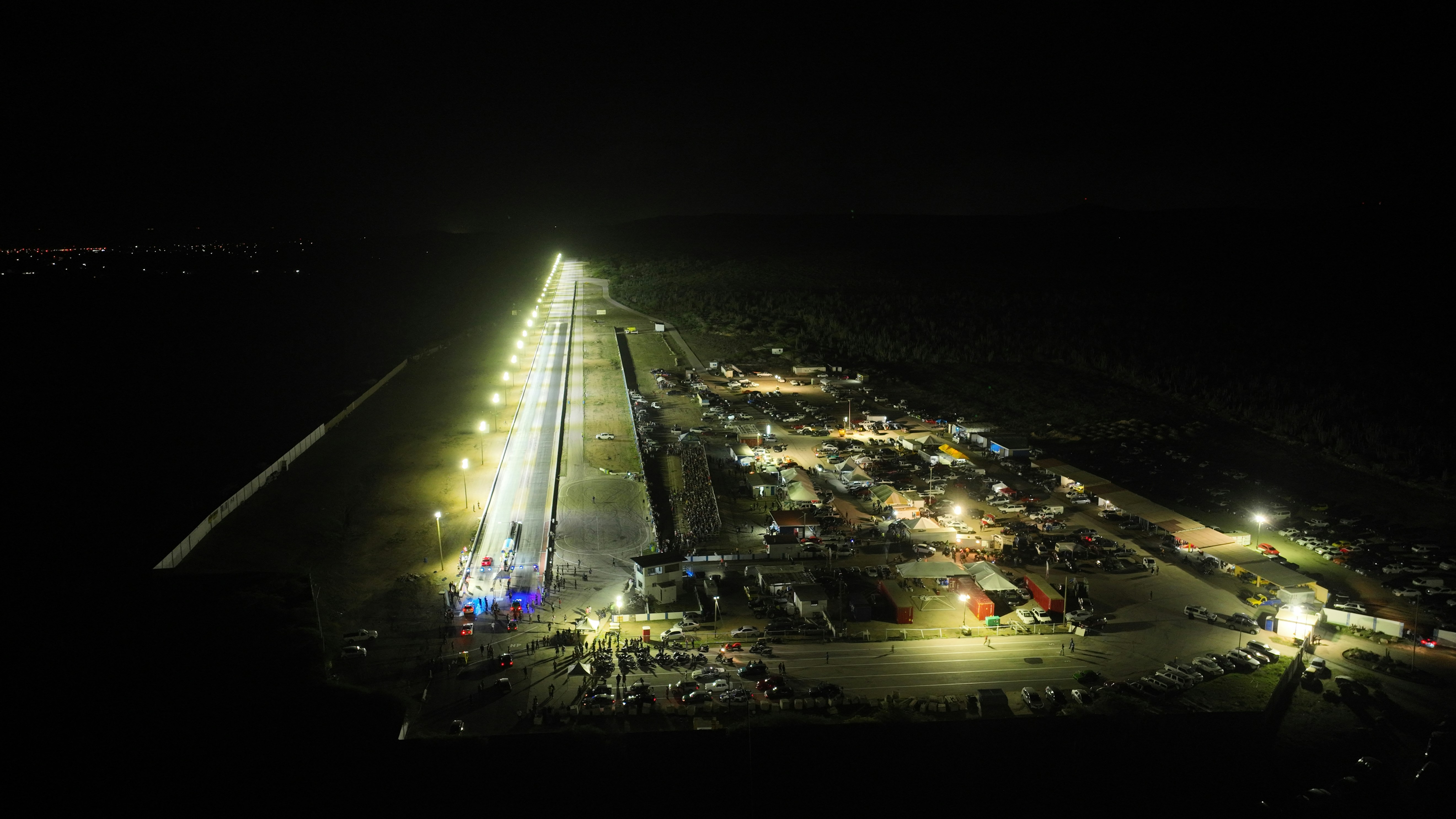 Night Strip: A Quiet Pier, Bright Fairgrounds