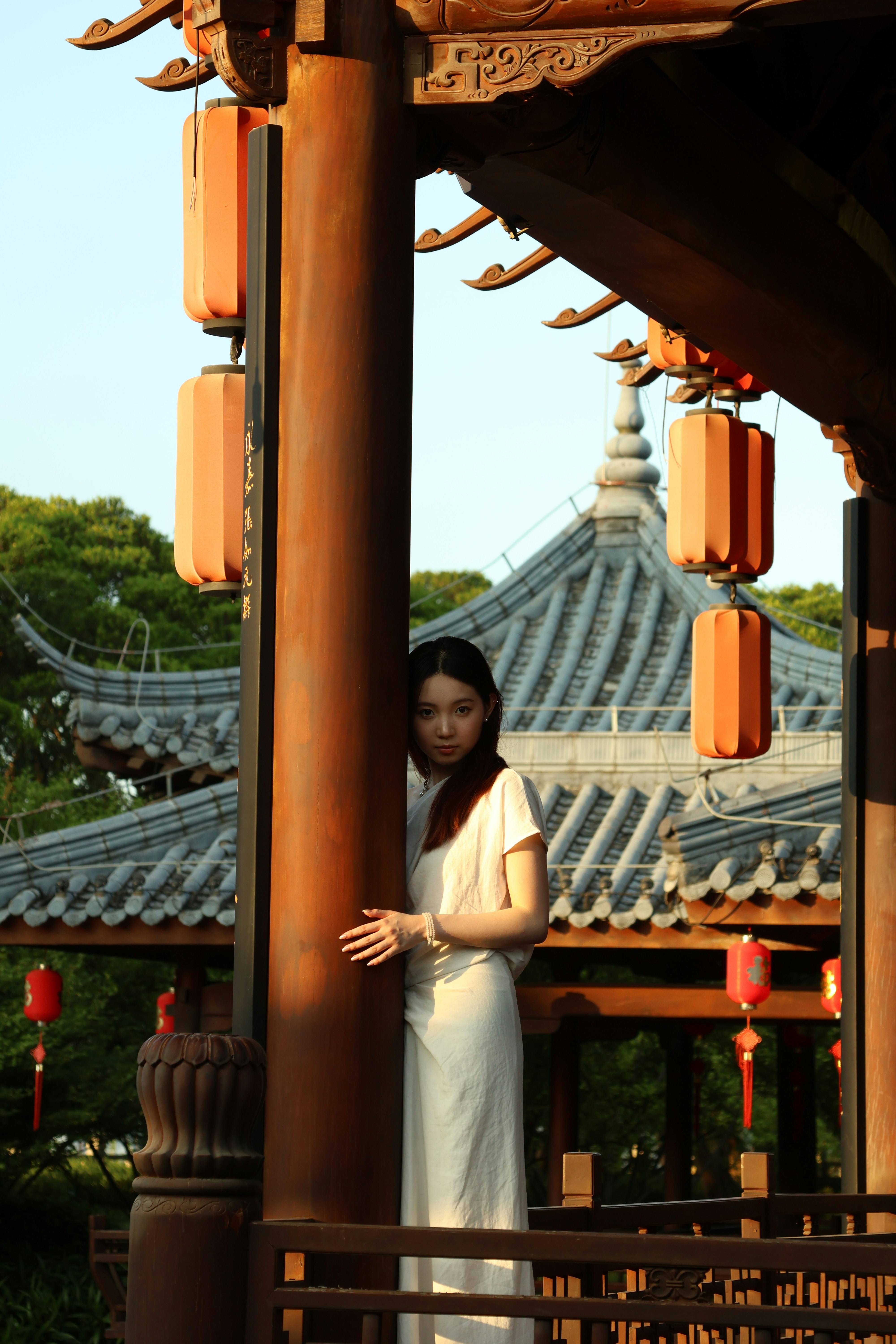 Portrait in the Pavilion: Quiet Confidence Among Lanterns