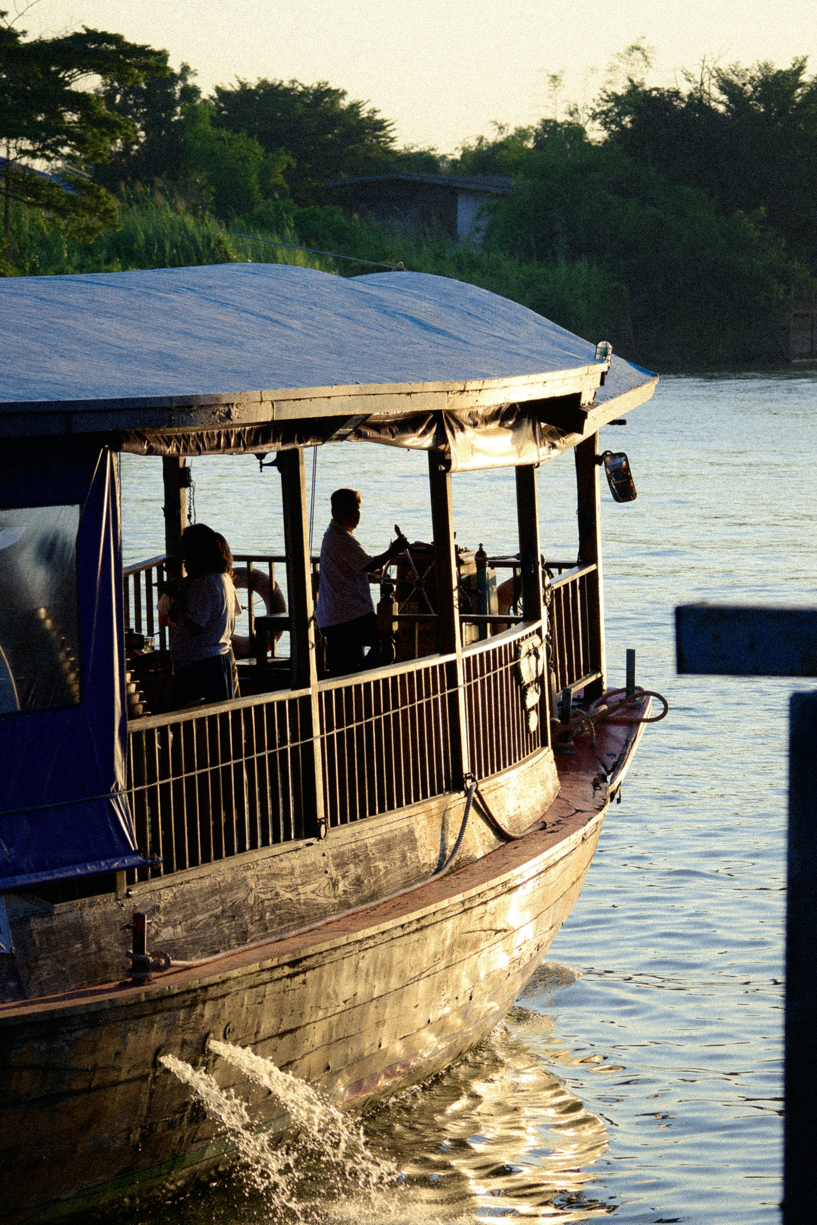 The Riverward Vessel: Crew at Dusk on a Marooned Boat