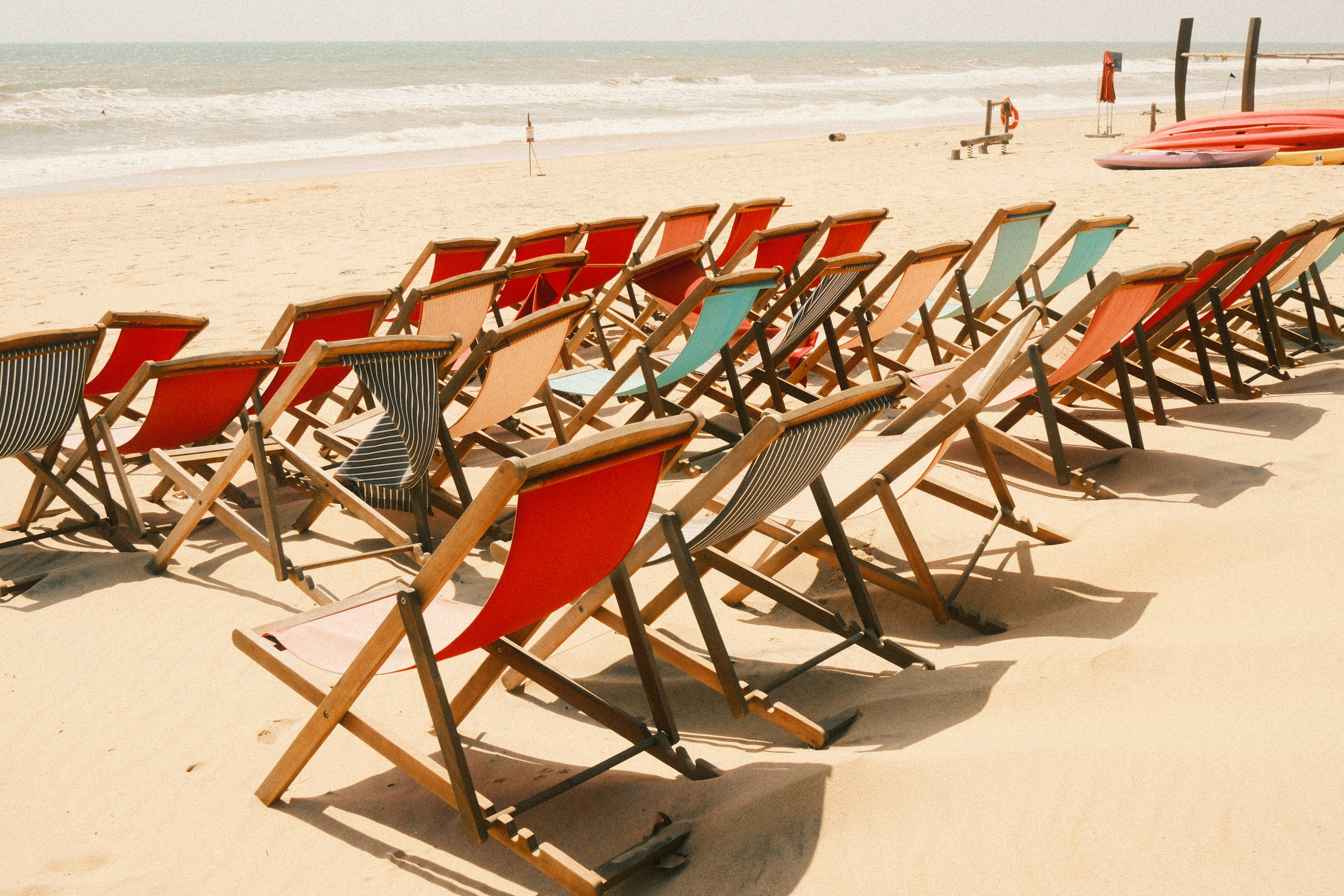 Row of Beach Chairs in Golden Sand: A Quiet Sea Breeze Scene