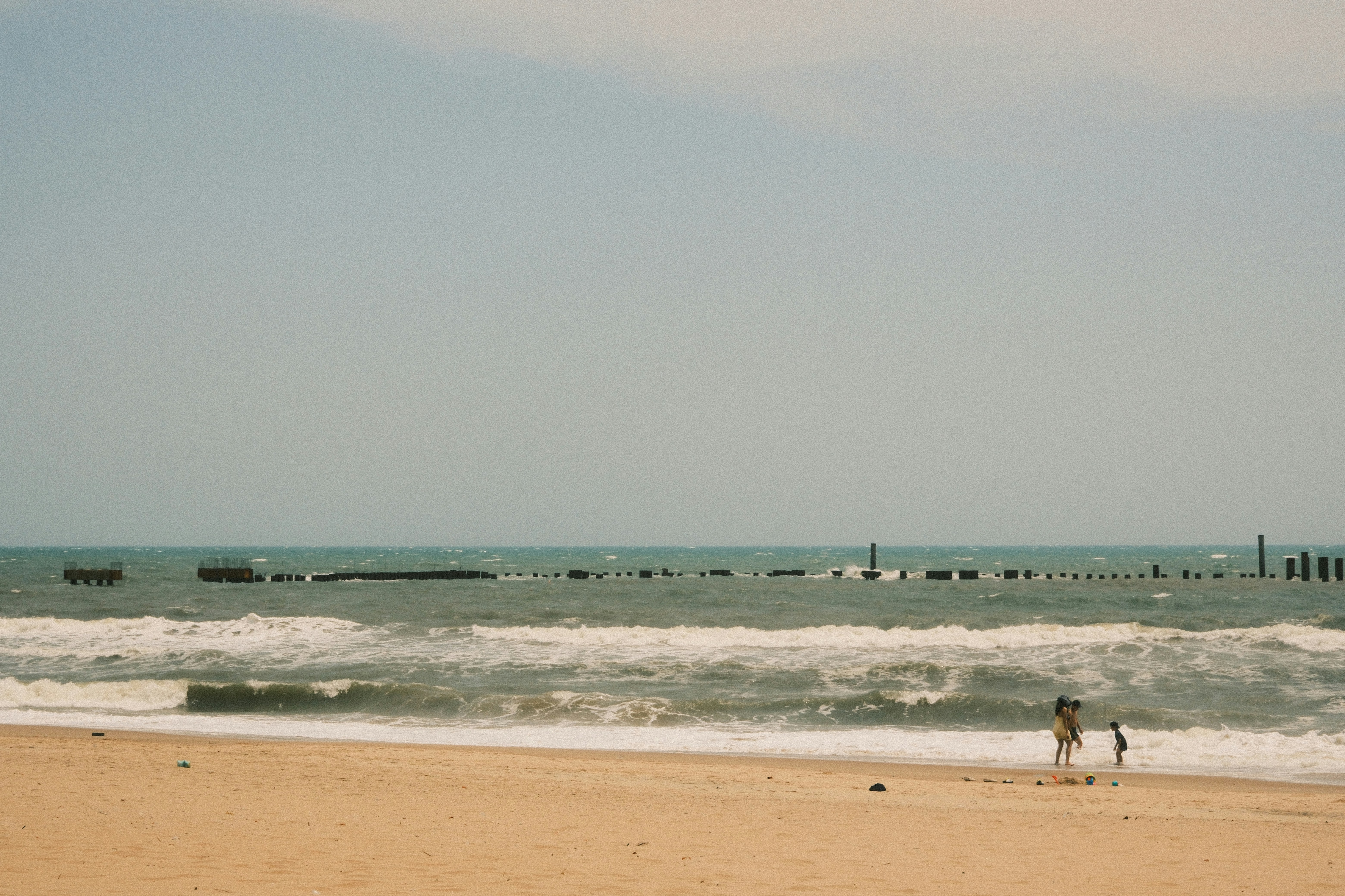 Two Figures at the Edge of the Ocean