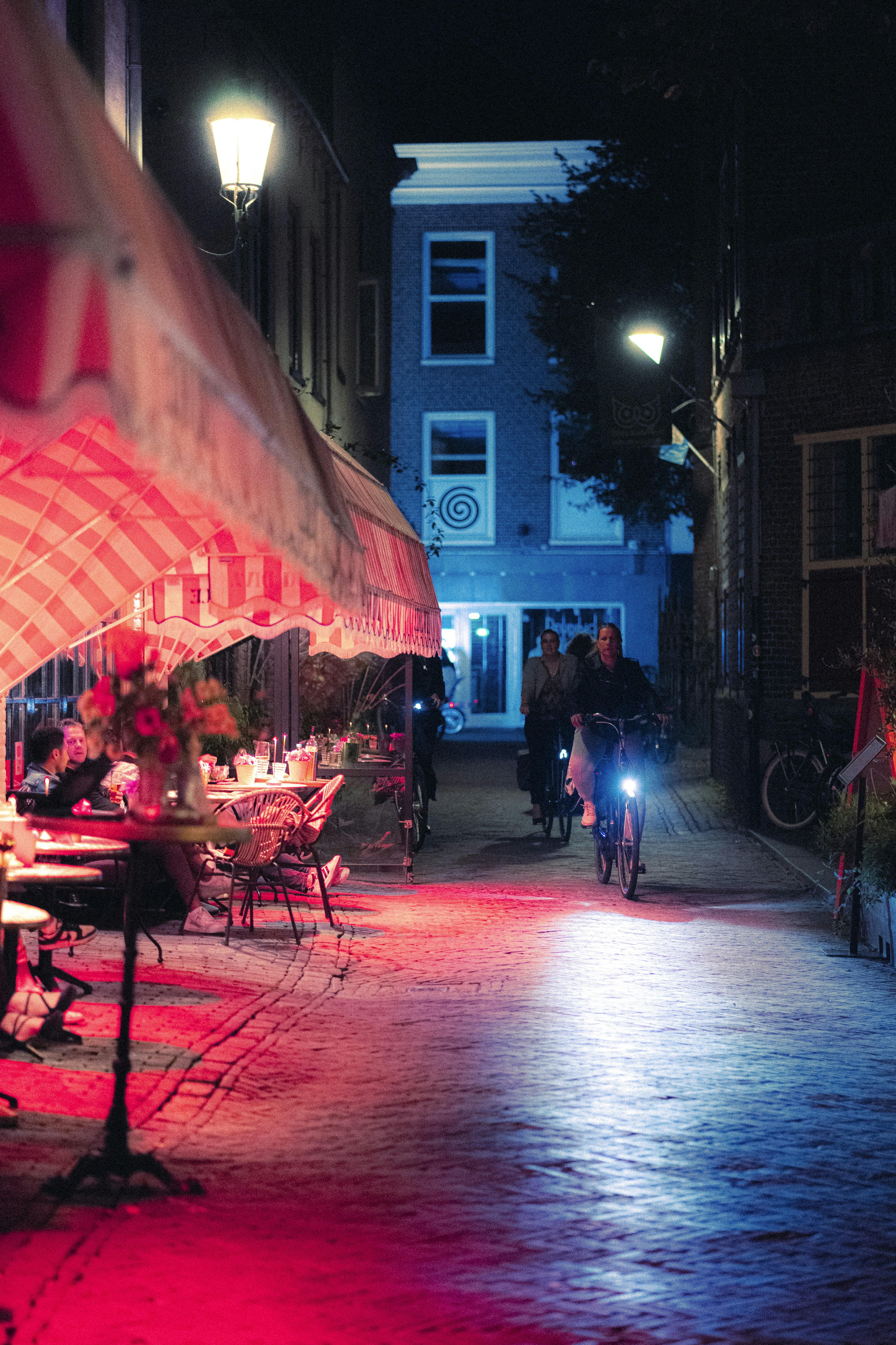 Neon Night on a Cobblestone Street