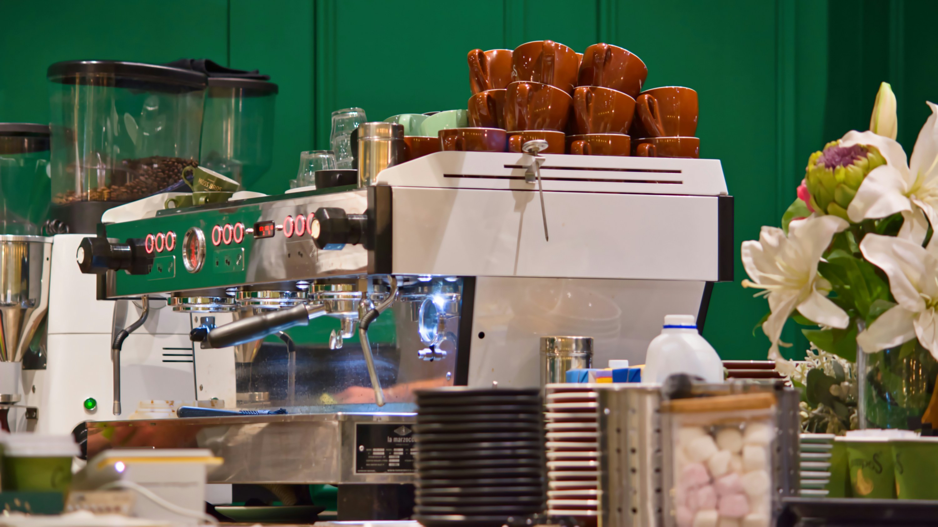 Espresso Bar Constellation: A Cluttered Café Counter with Stacked Cups