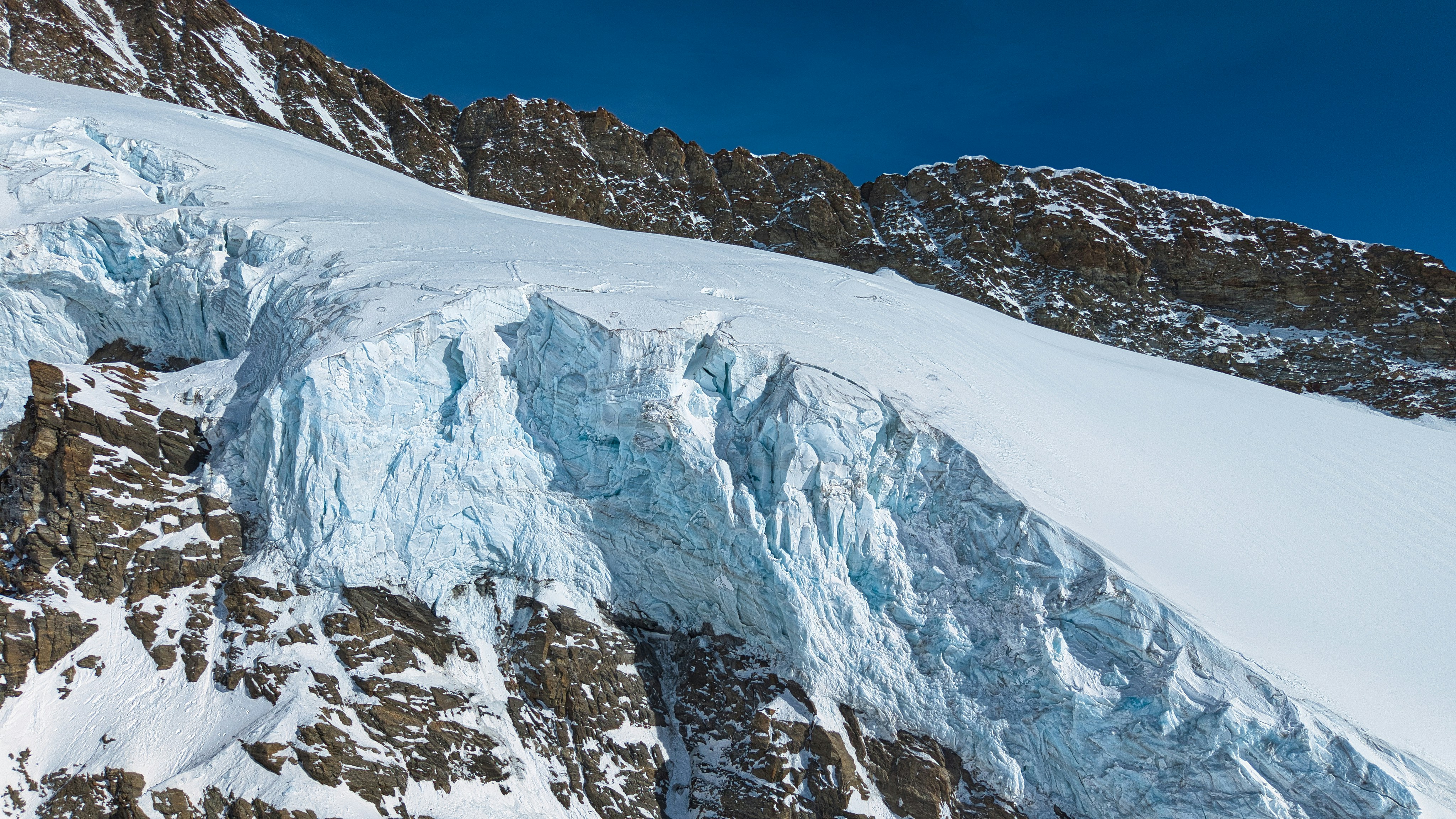 Icefall Curtain Over jagged Ridge
