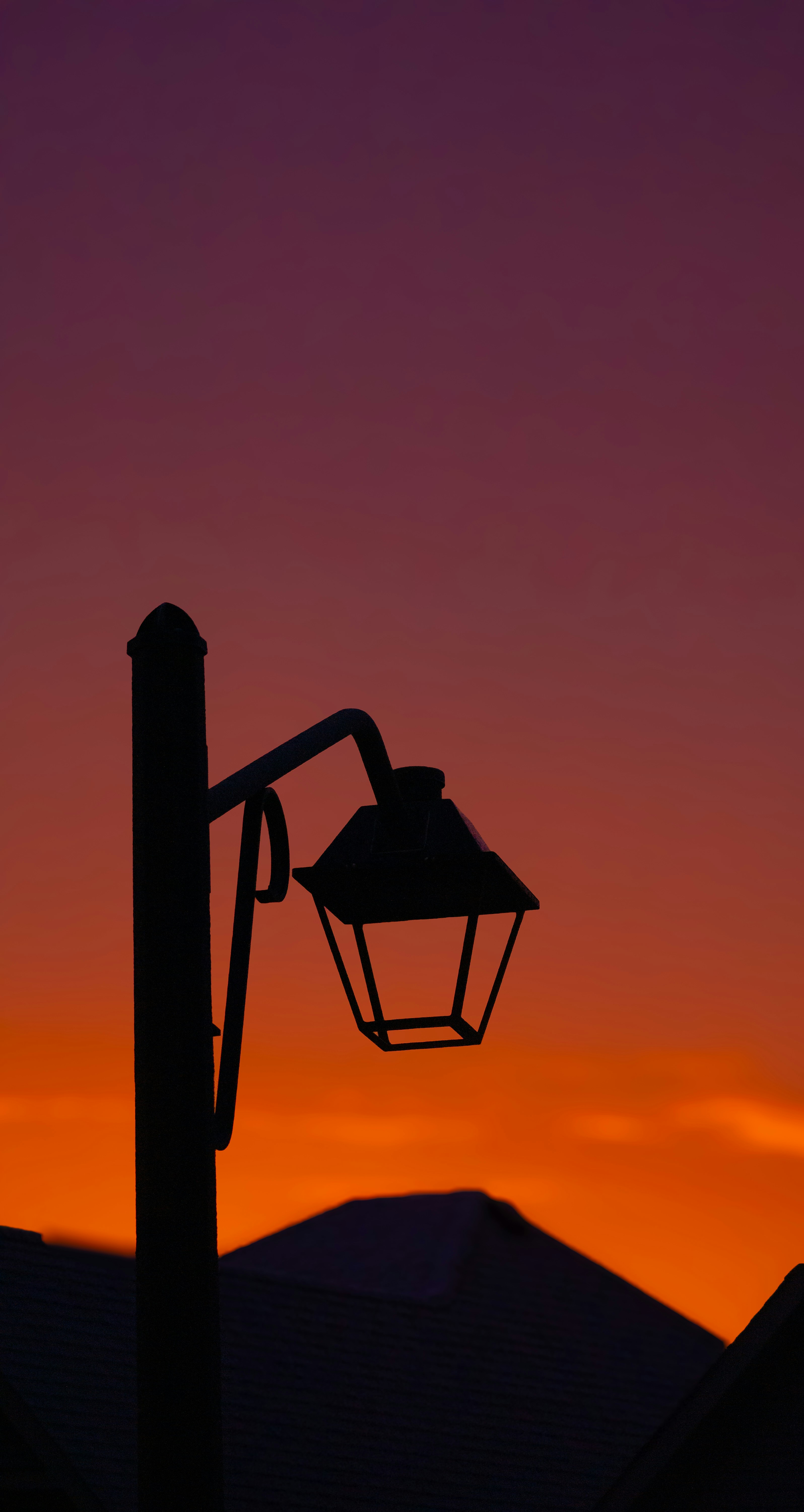 Silhouetted Lantern Against a Fiery Dusk