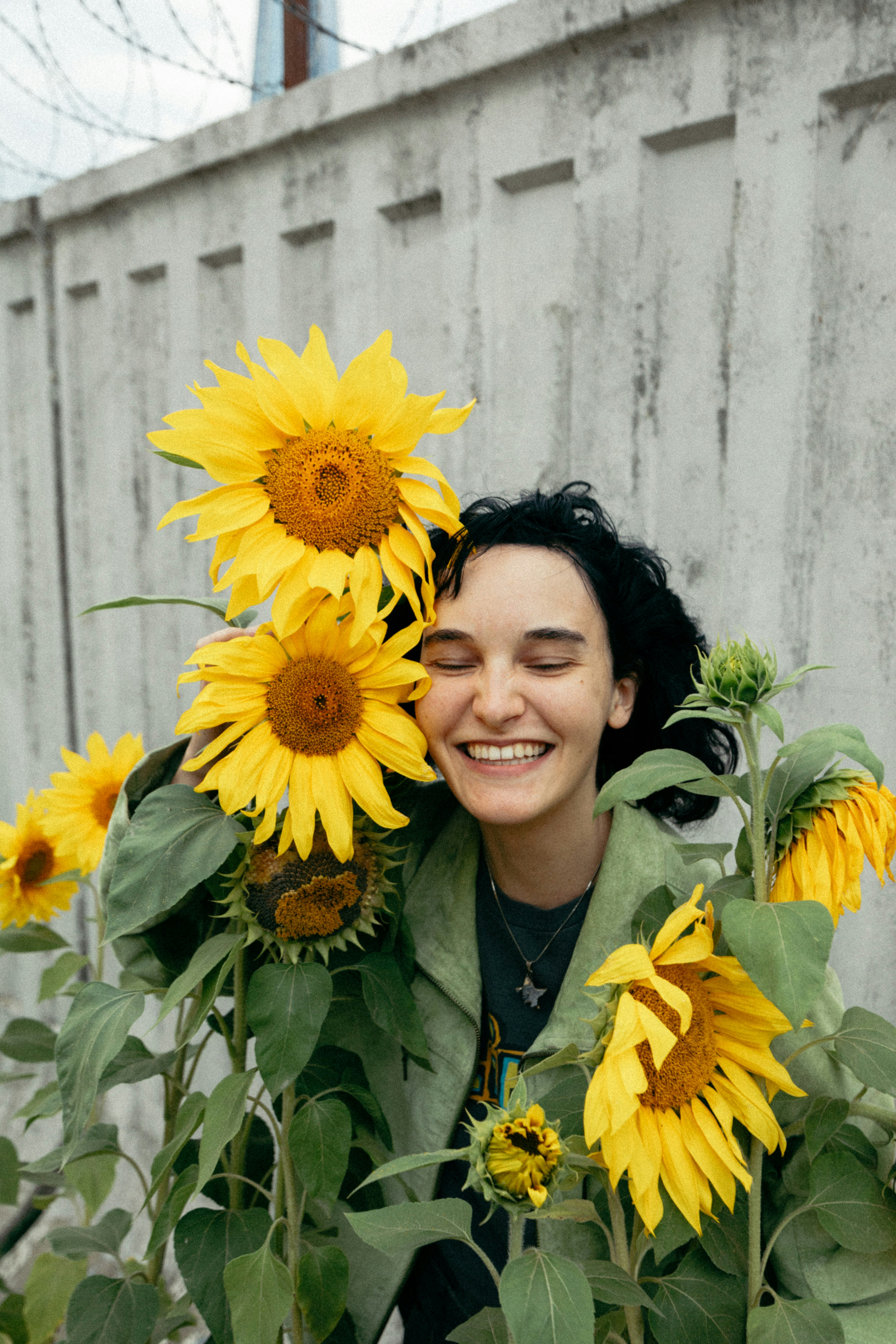 Sunflowers and a Smile: A Moment of Sunshine Amid Concrete