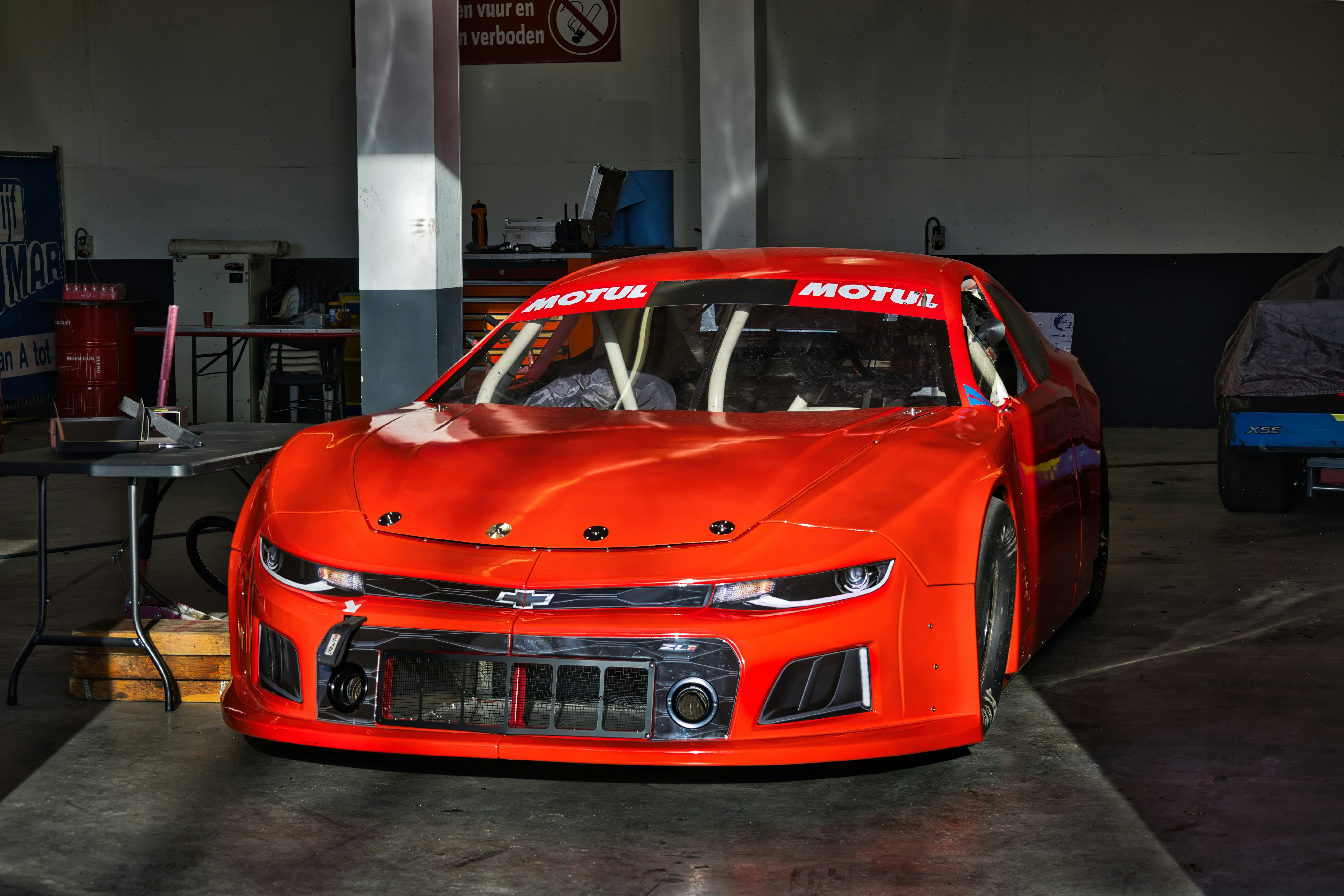 Red Thunder in the Pits: A Carpentered Racer Dawns