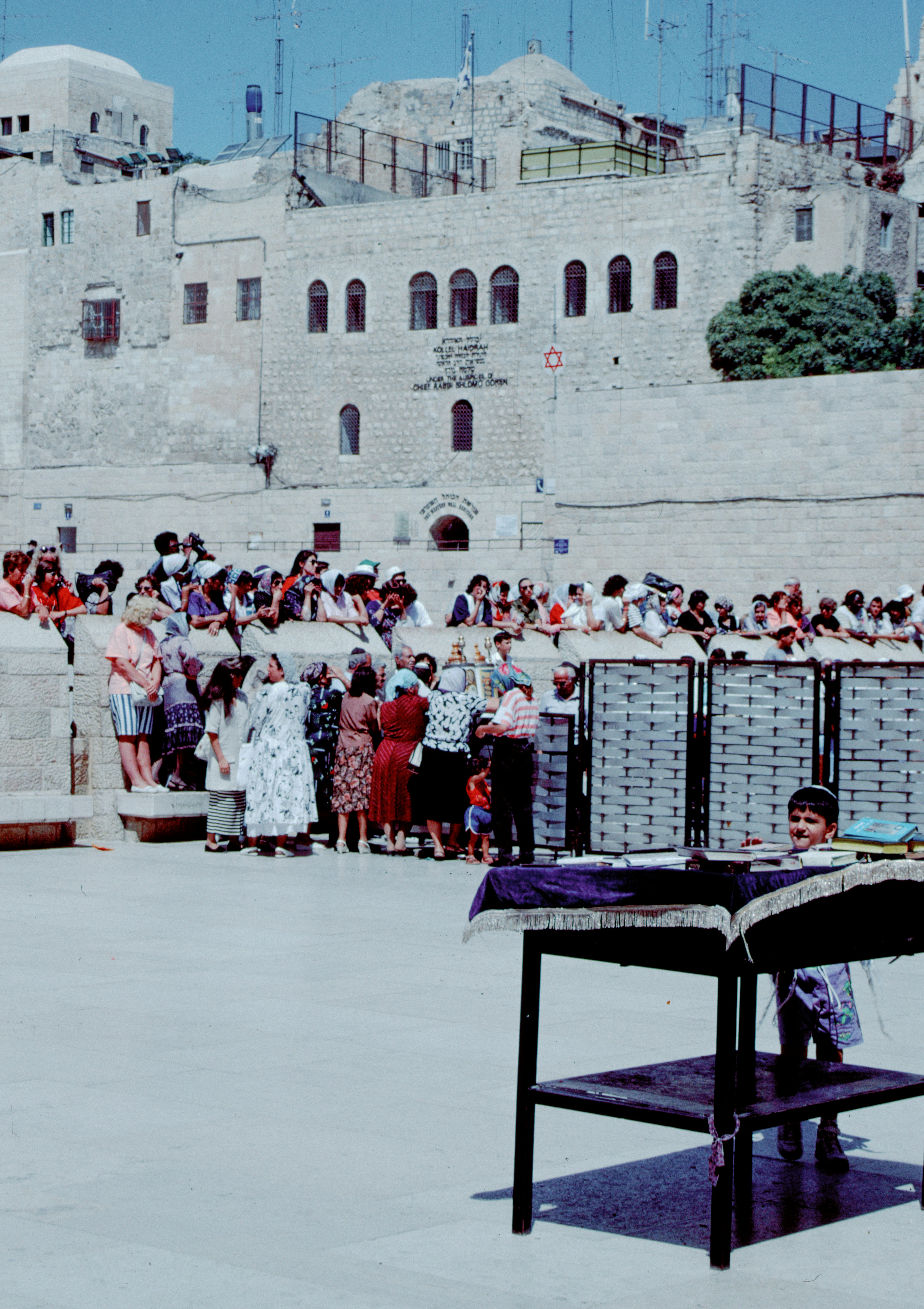 Crowd Beyond the Fortress Wall: A Market Scene Near the White Stone Citadel