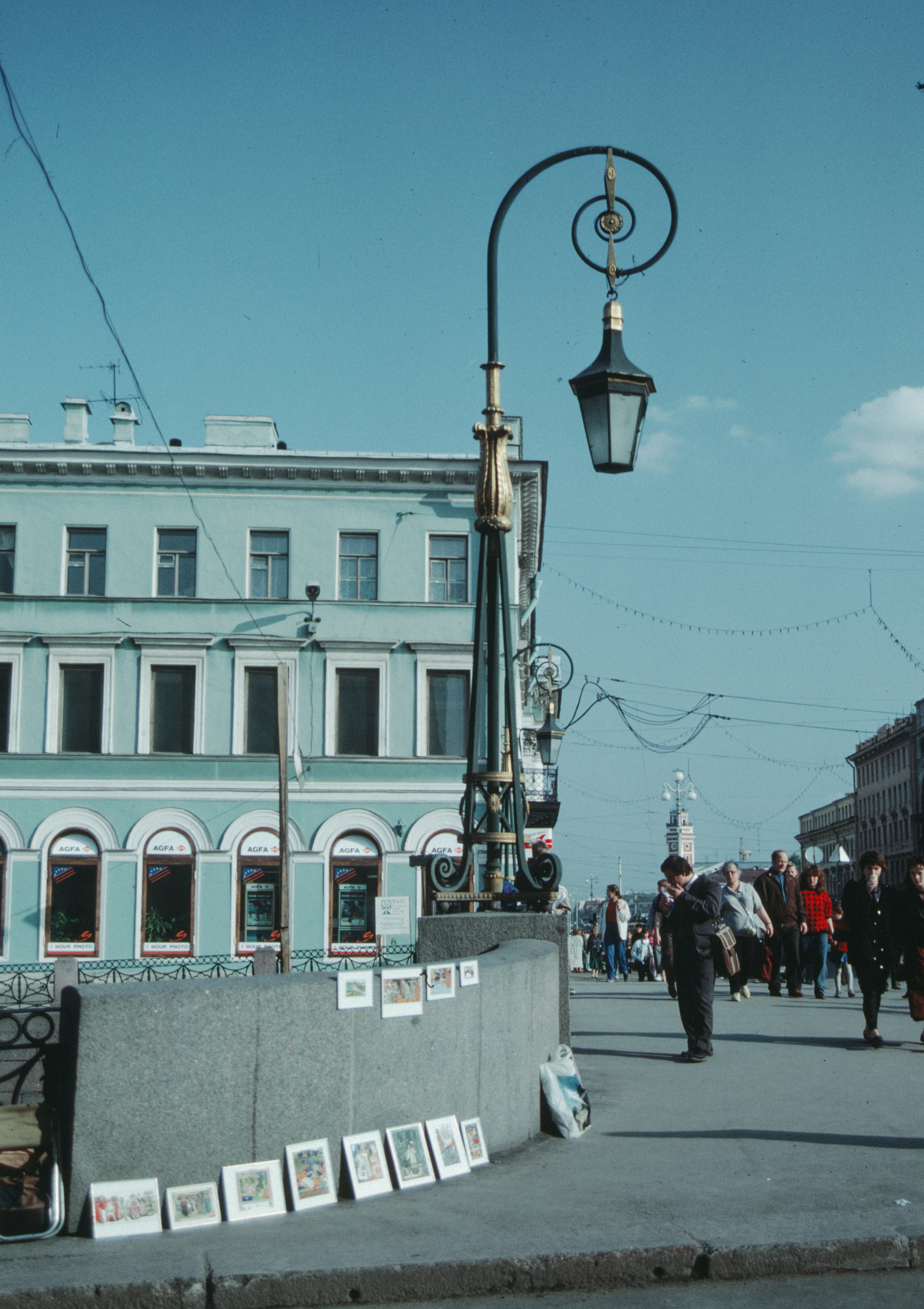 Blue Facade and Street Lantern: A Quiet City Crossing
