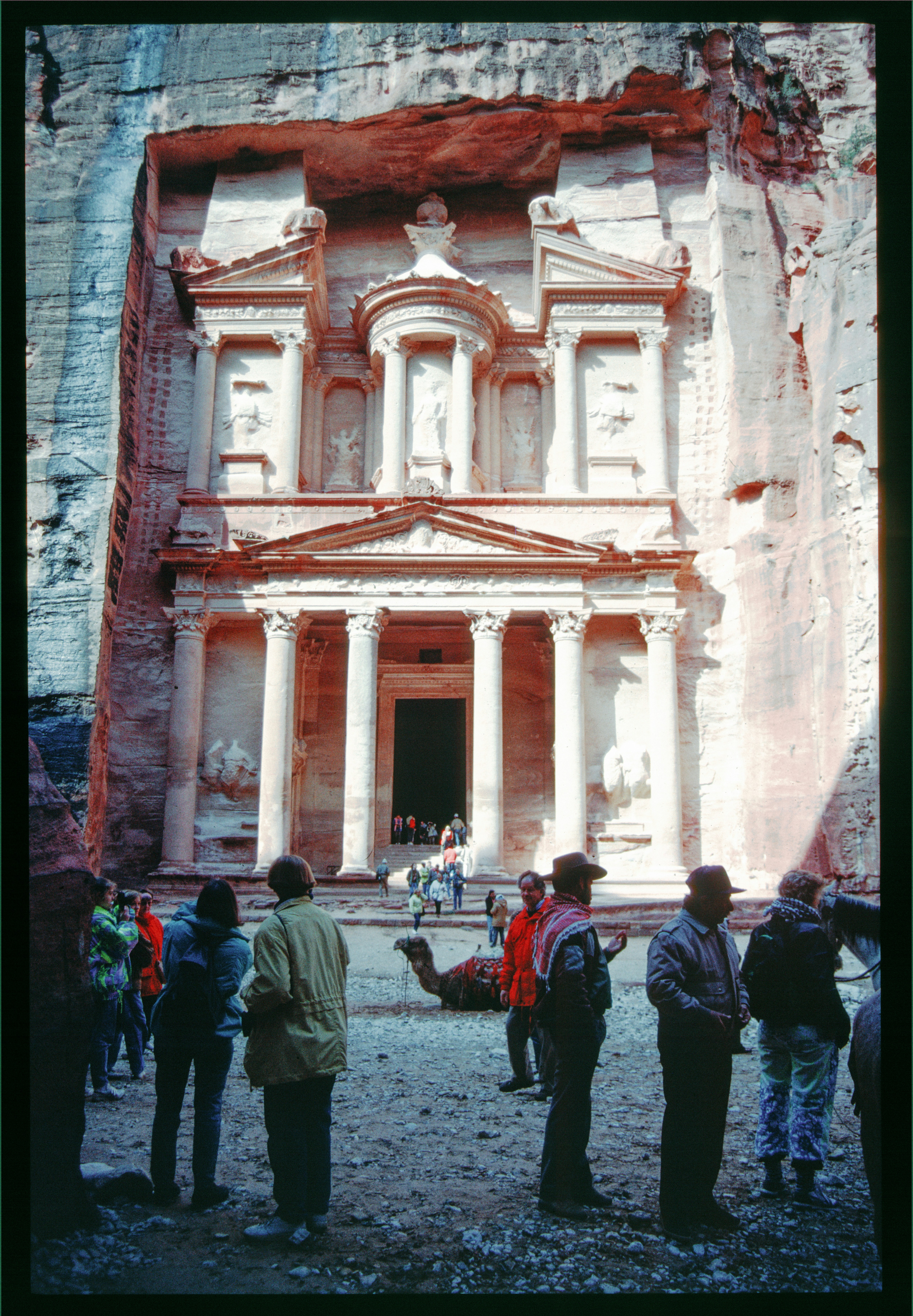 Crowd at the Entrance of a Stone Facade Cut Into a Carved Cliff