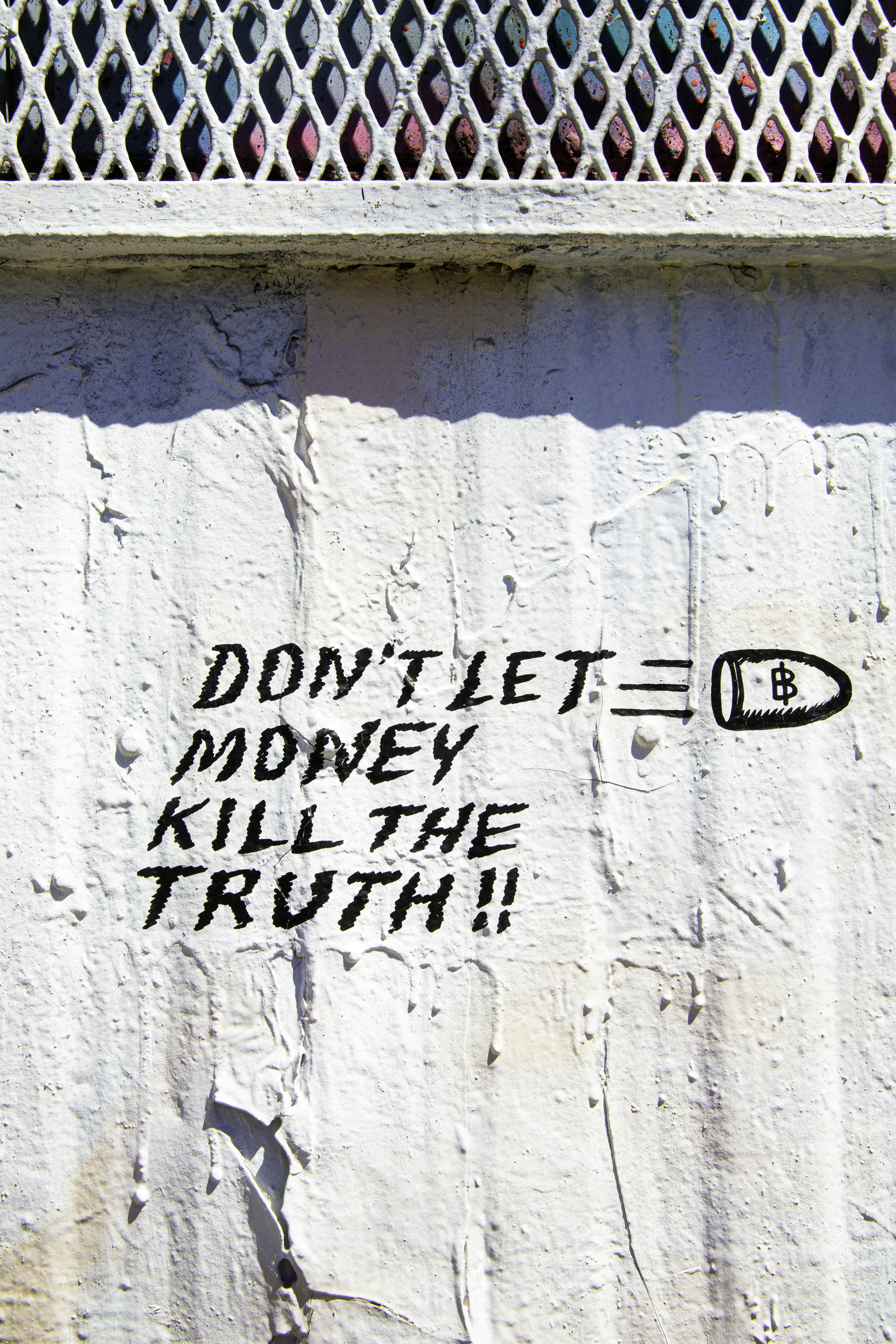 Truth on White Concrete: Graffiti Sting on a Graffitied Wall