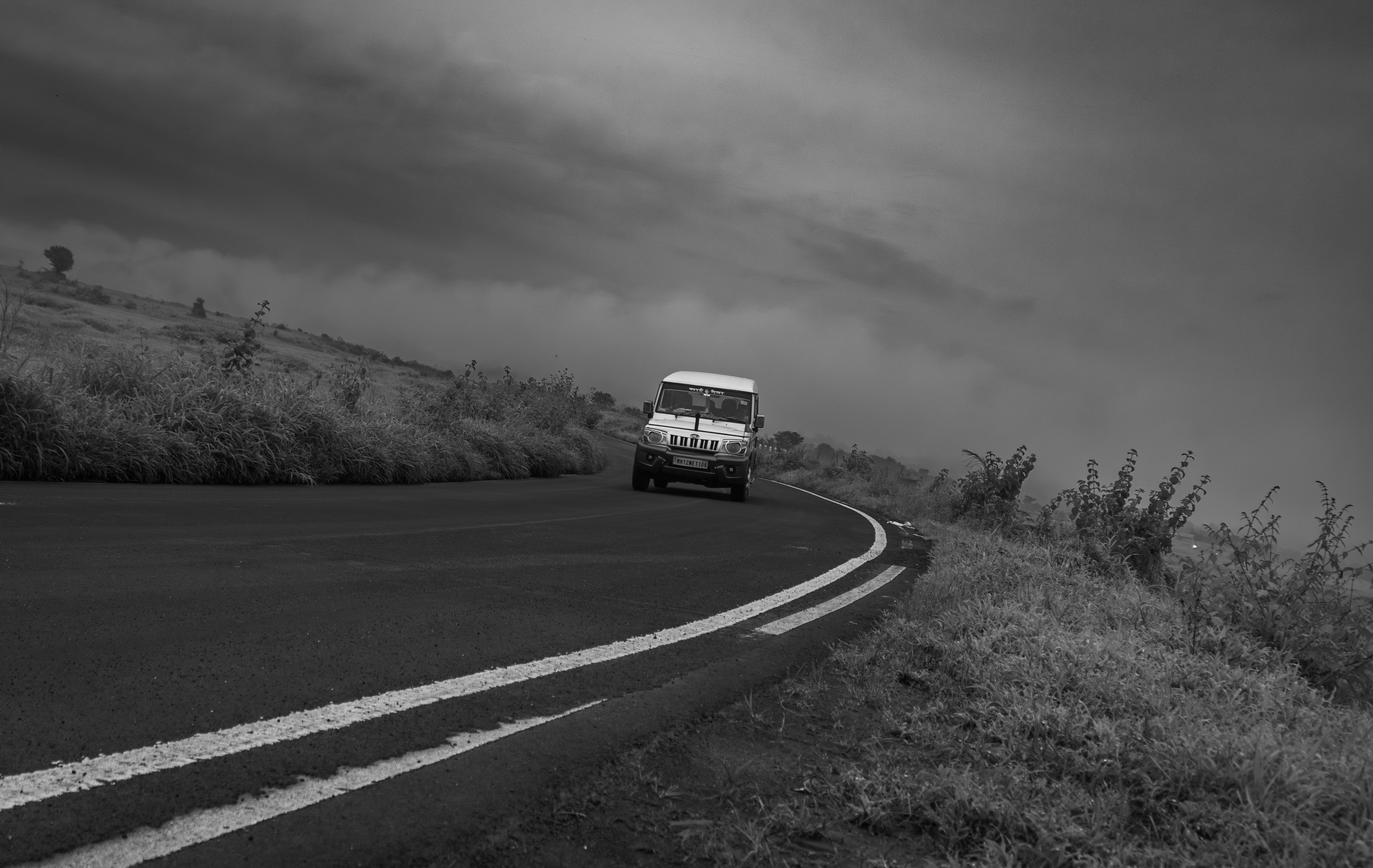Roadside Odyssey: A lone van on a quiet bend