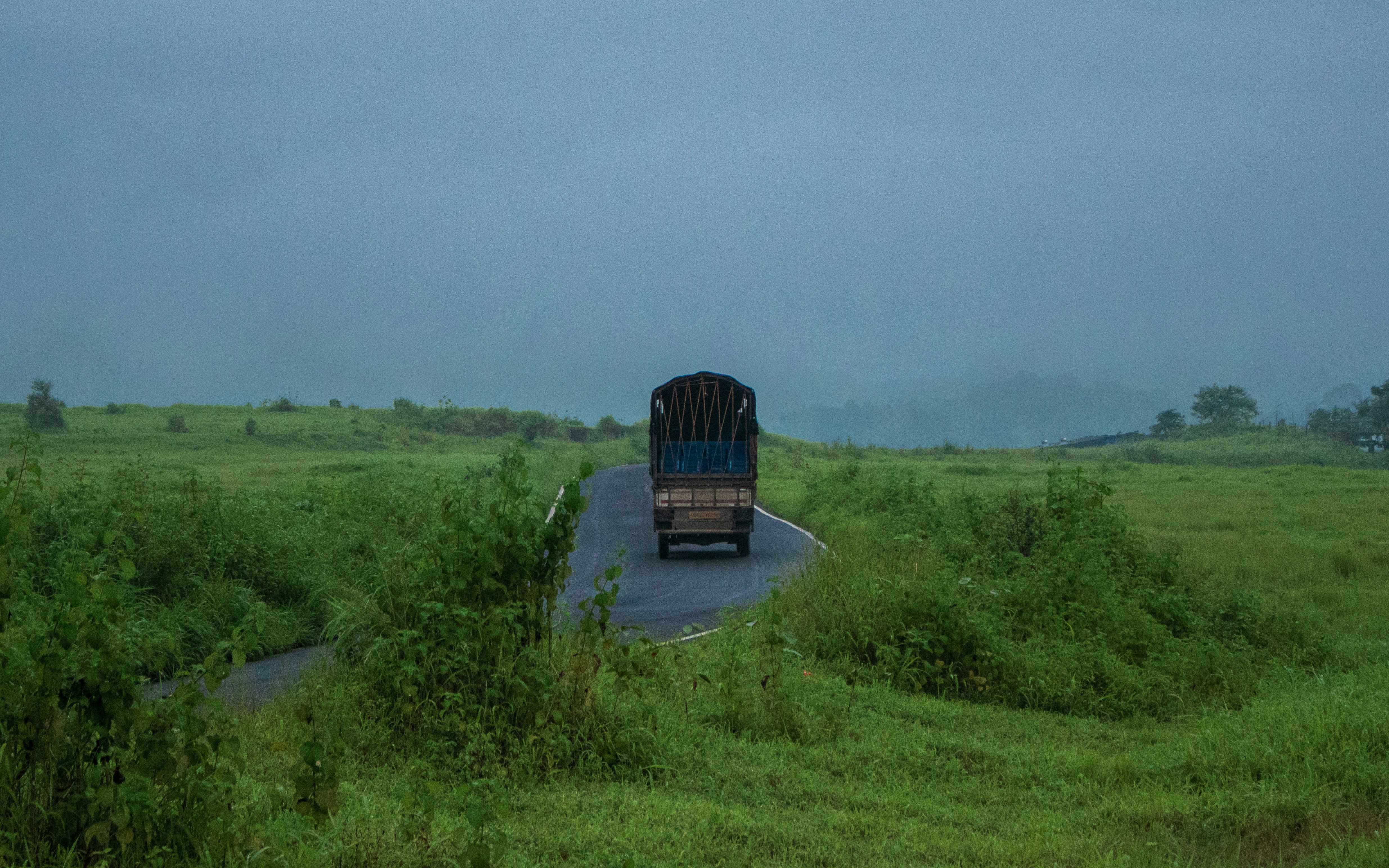 Rural Route: A lone truck on a winding green lane