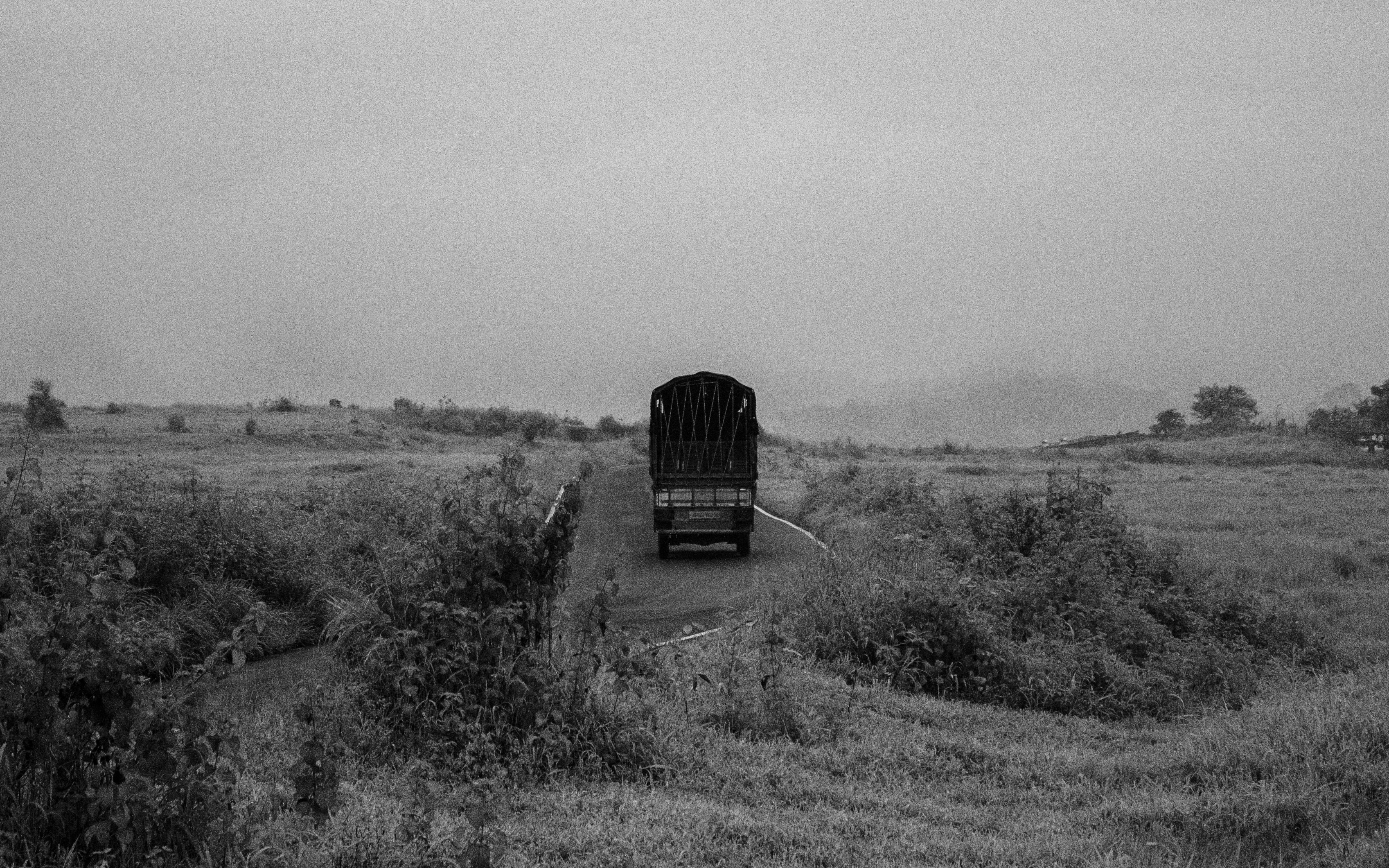 Dusty Dawn: A Rural Truck Treads a Quiet Path