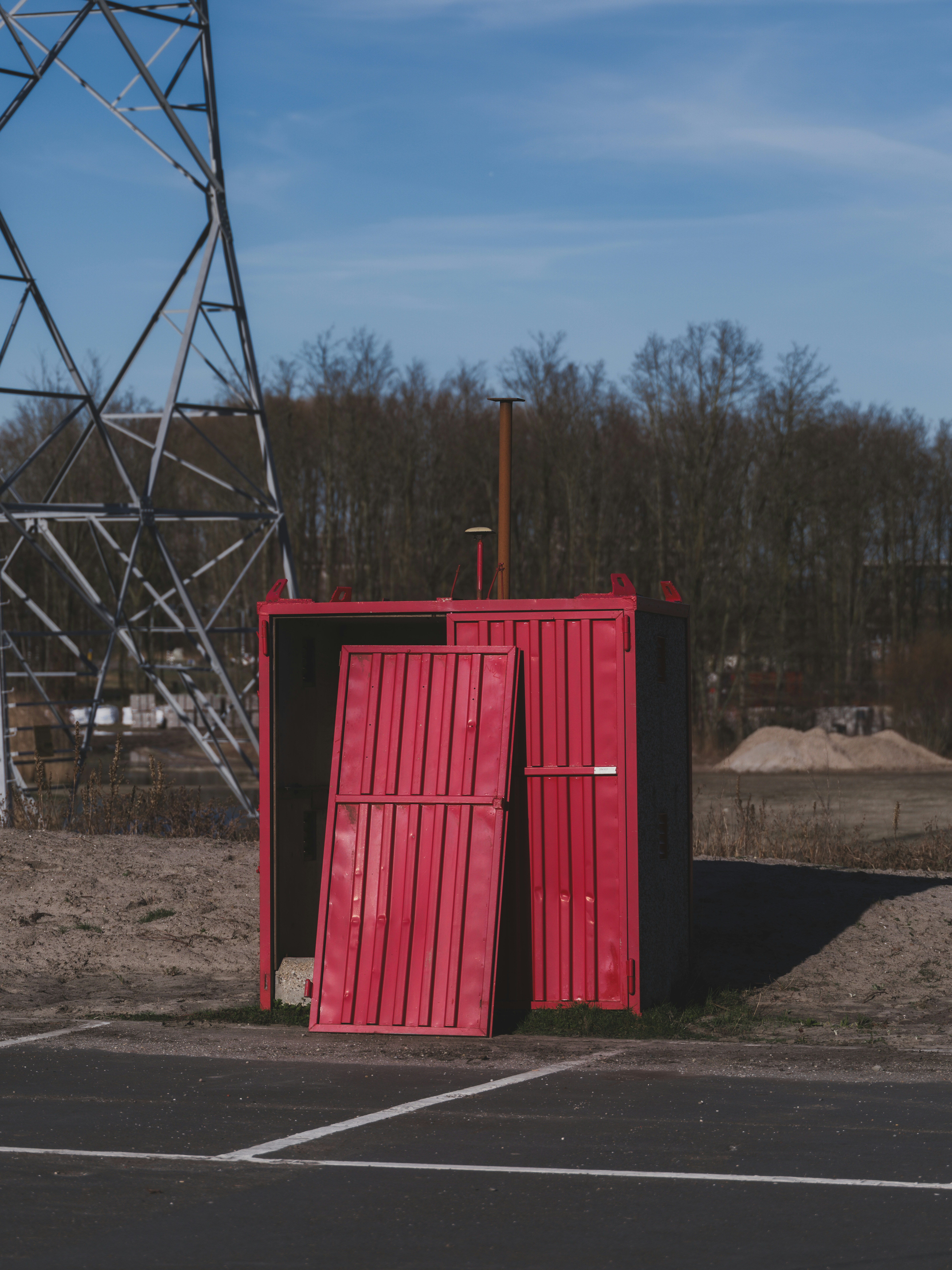 Red Cabins in a Field: Quiet Isolation by the Power Tower