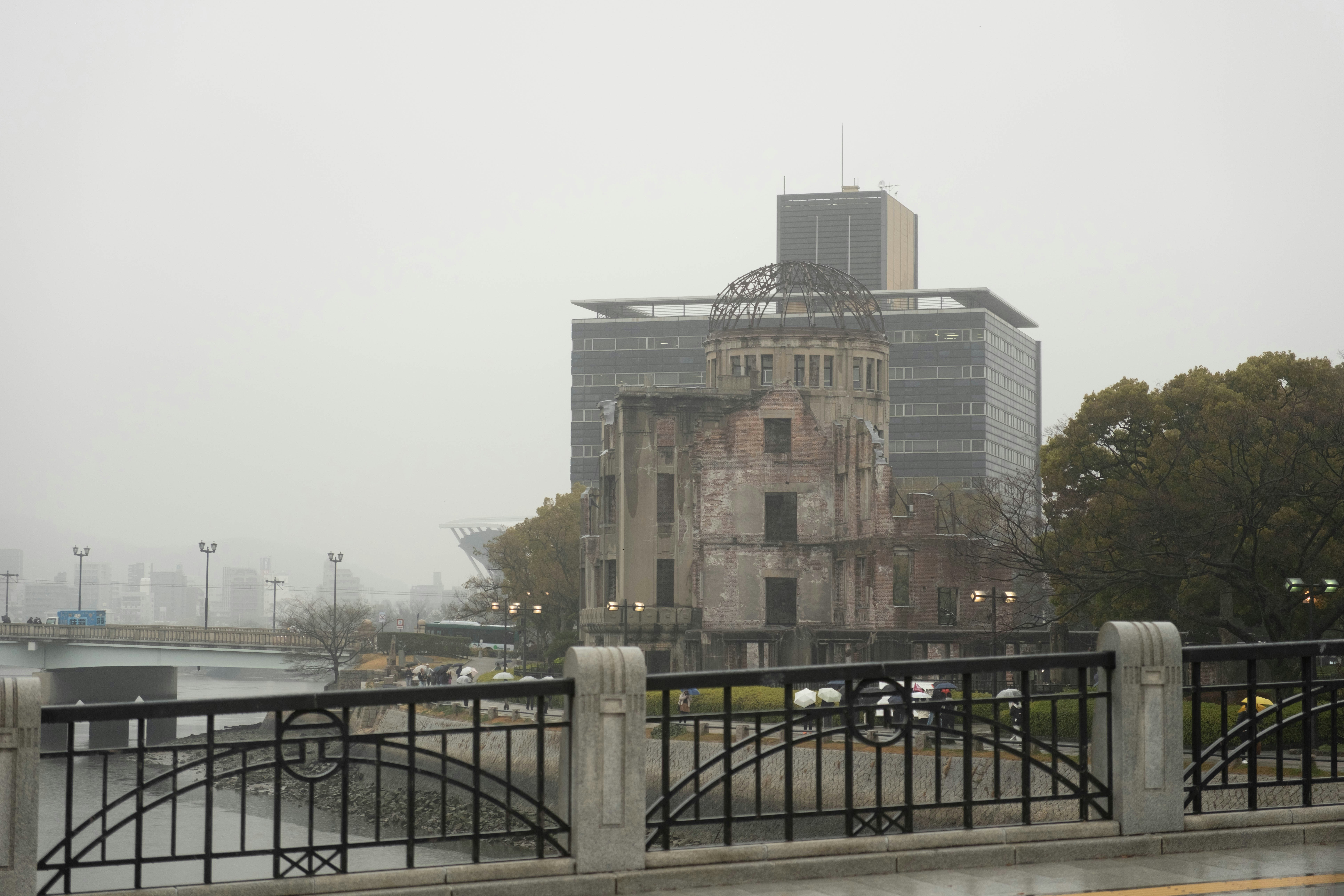 Ruins by the River: A Weathered Landmark Against Urban Glass