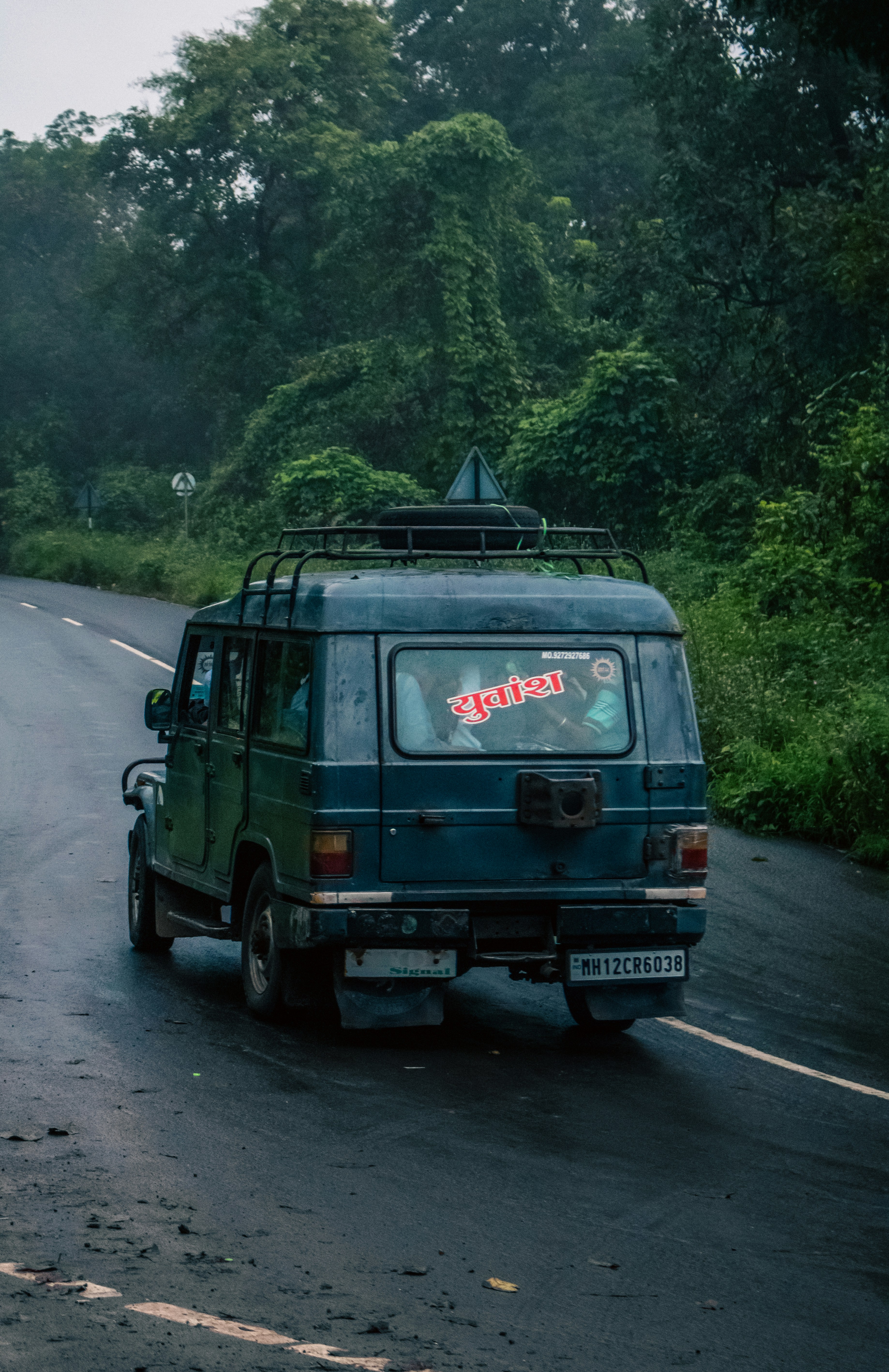 Blue Paramedic on a Rainy Road: A Distant Journey
